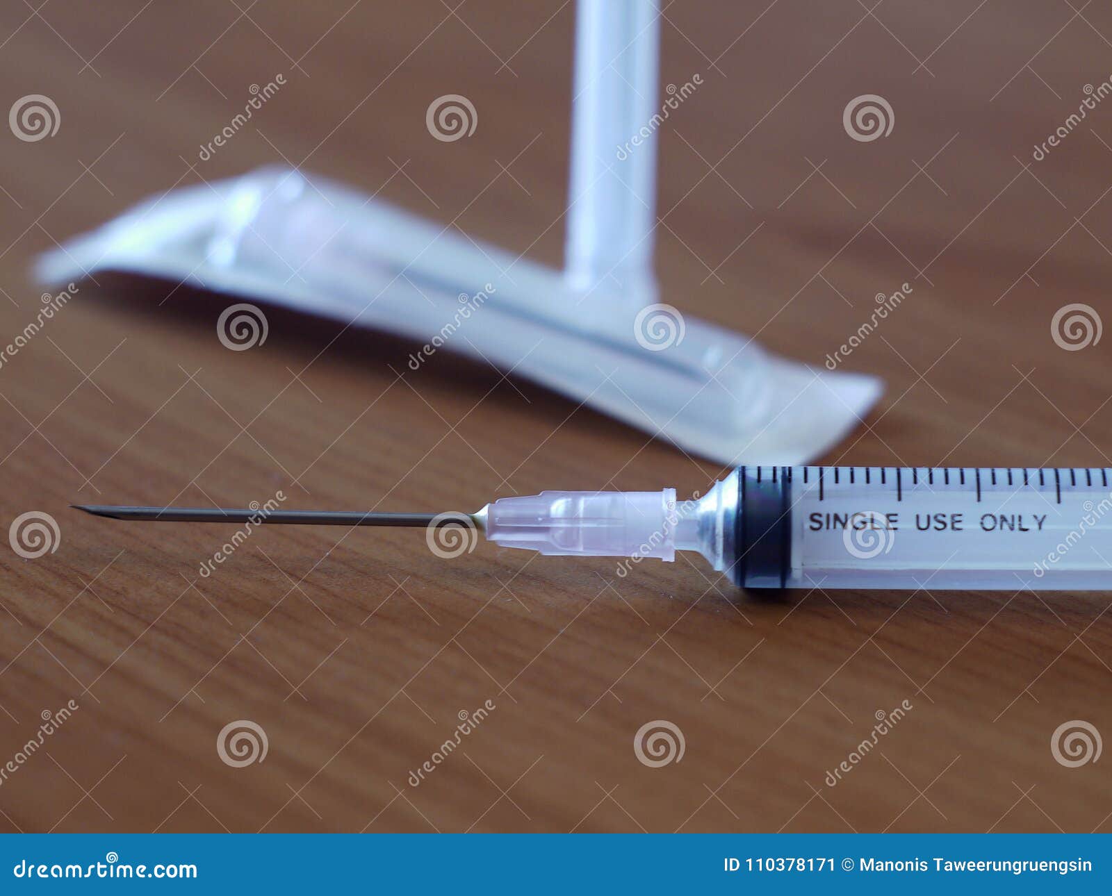 Injection Needle Syringe on Wooden Table with `single Use only` Word on ...