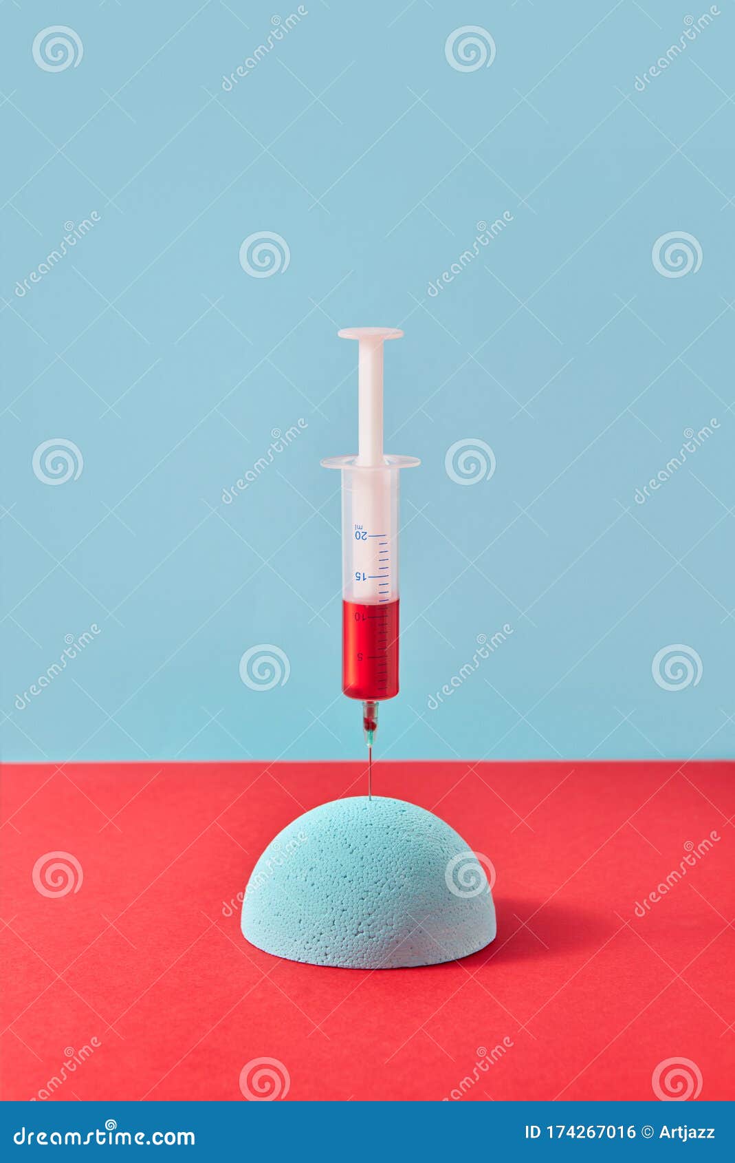 Injection of Syringe with Red Liquid into Styrofoam Hemisphere. Stock ...