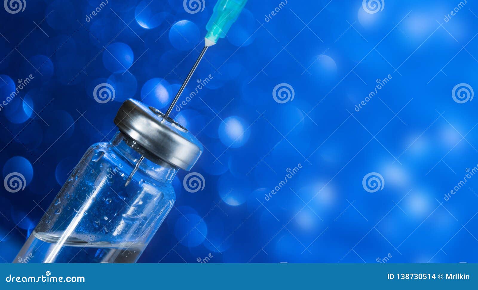 Injection Vial with Syringe Needle on Blue Background Stock Photo ...