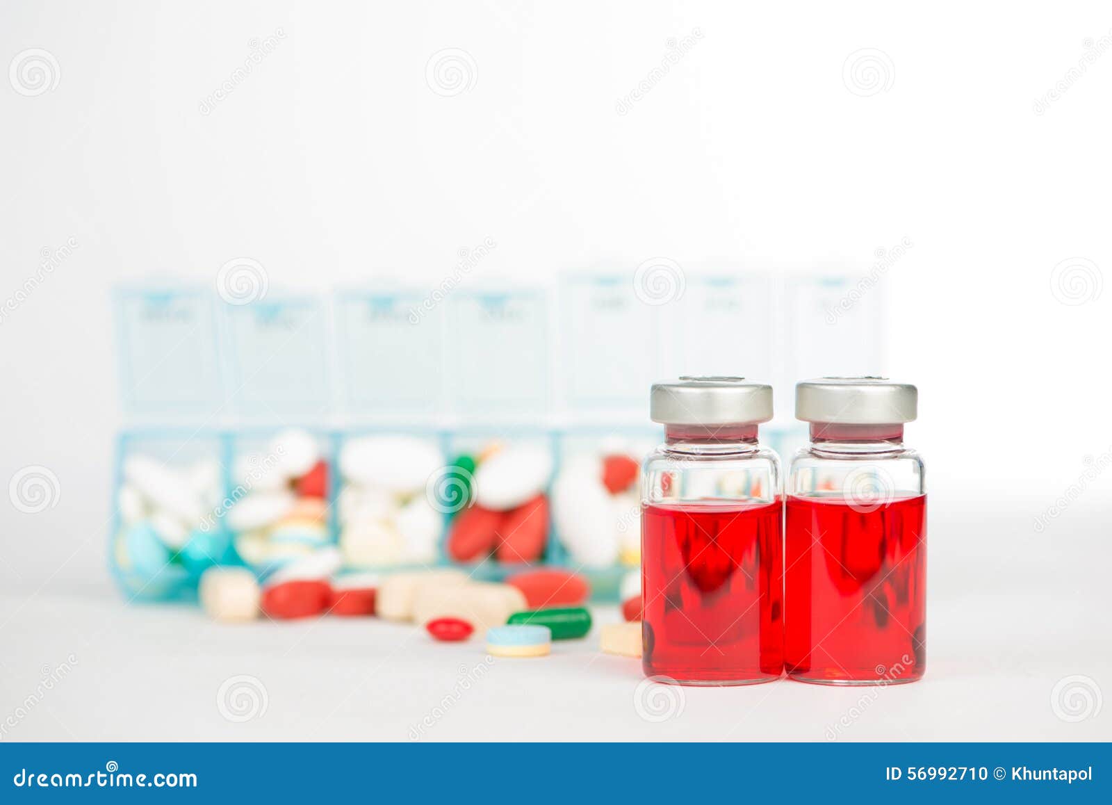 Injection Vials and Medicine in Weekly Pill Box Stock Photo - Image of ...