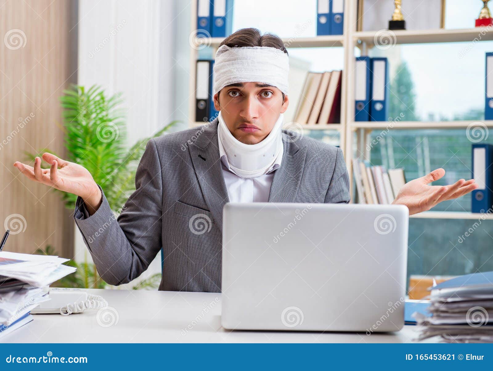 Injured Businessman Working in the Office Stock Image - Image of back ...