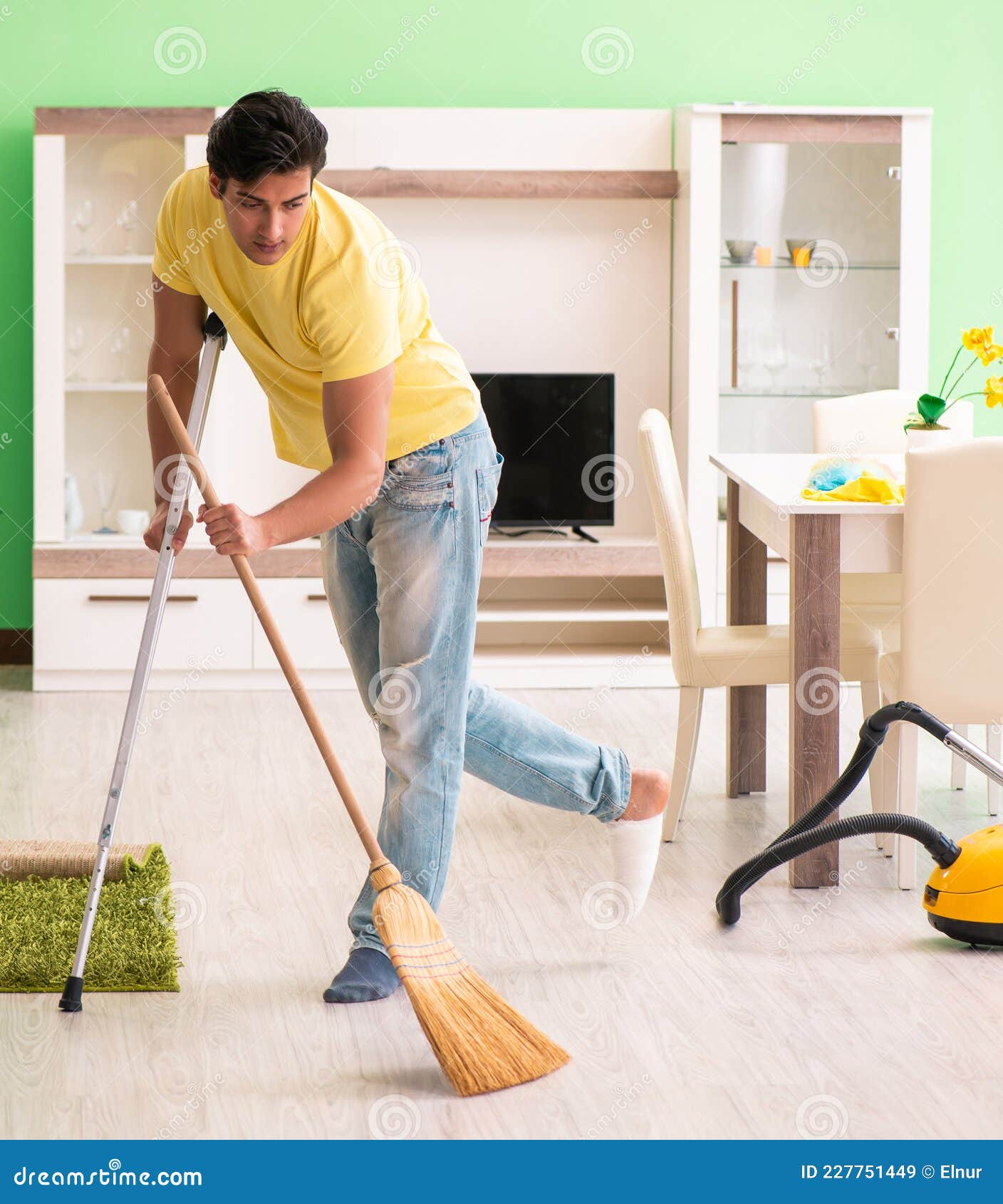 Injured Man on Crutches Cleaning House Stock Image - Image of ...