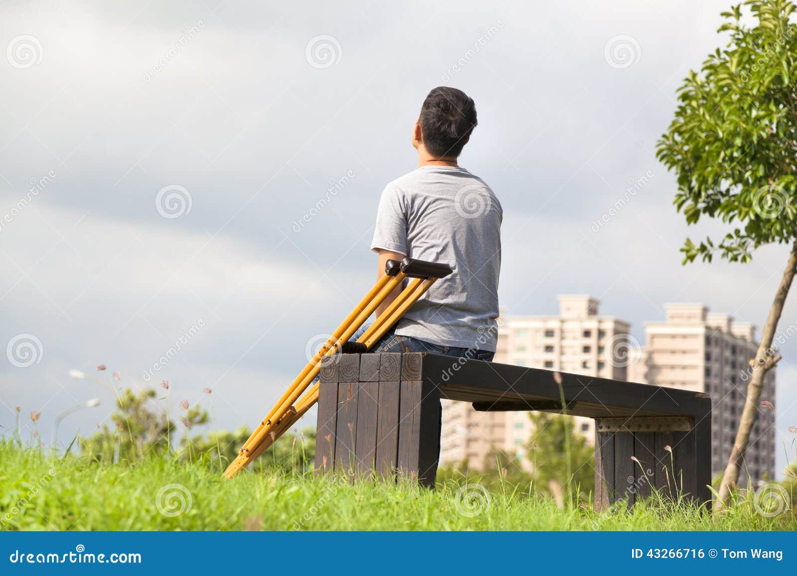 Injured Man with Crutches Sitting on a Bench Stock Photo - Image of ...