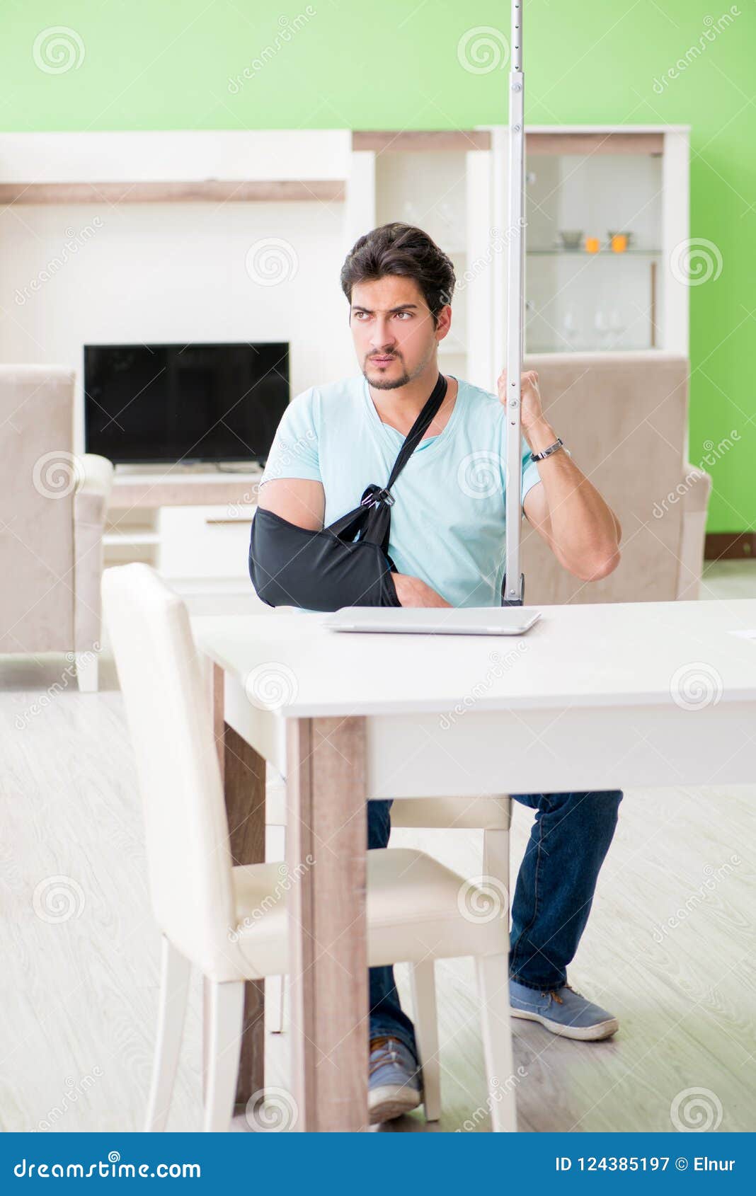 The Injured Man with Crutches Sitting at Home Stock Image - Image of ...