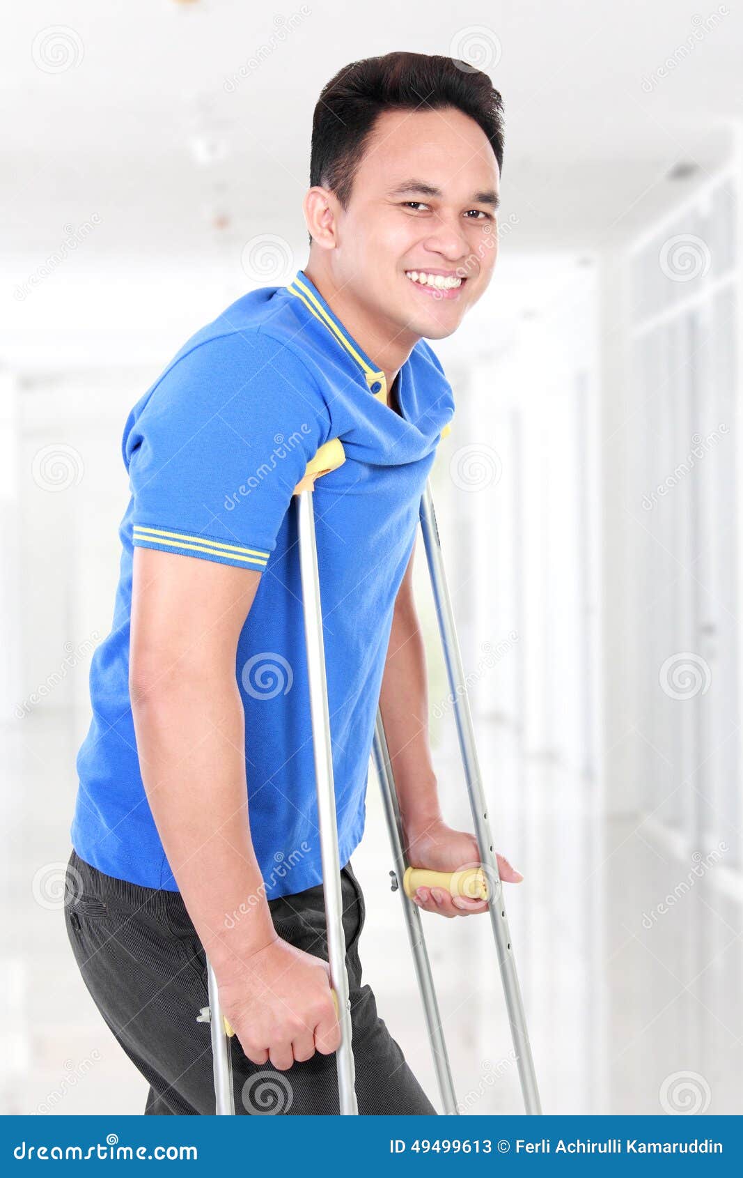Injured Young Man Walking with the Help of Crutches Stock Image - Image ...