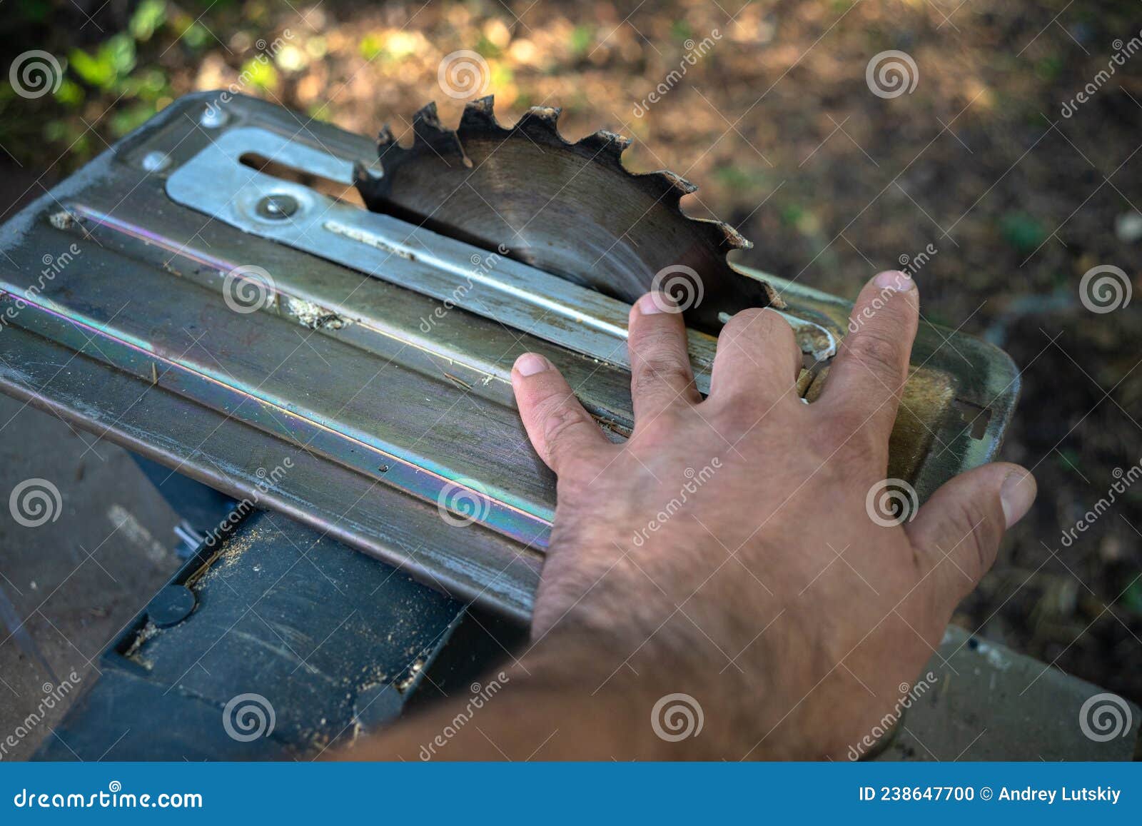 Injuries at Work. the Hand Gets into the Disk from the Saw. Danger of ...