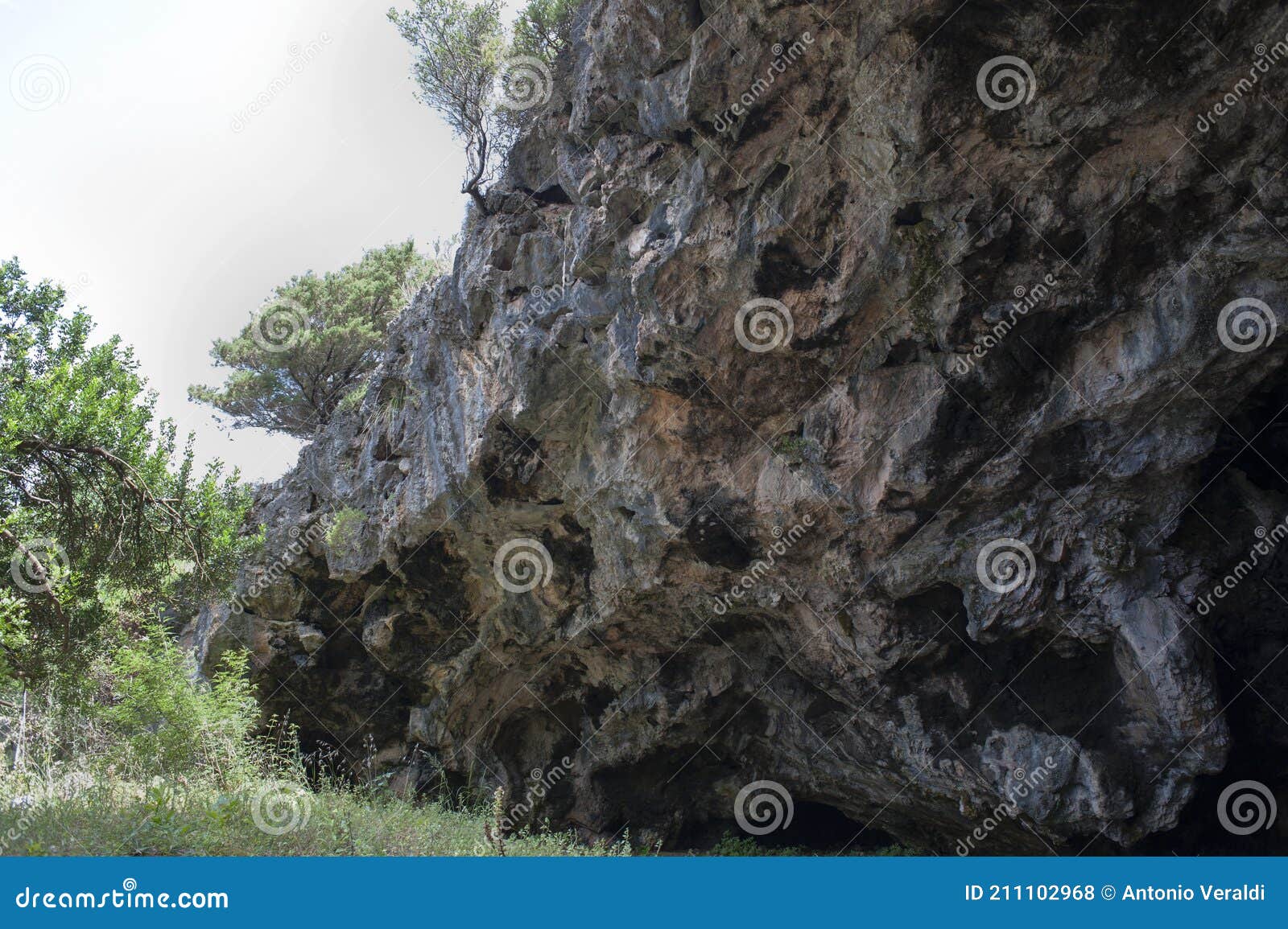 The Inland End of a Cavernous Cliff. Rockface. Stock Photo - Image of ...