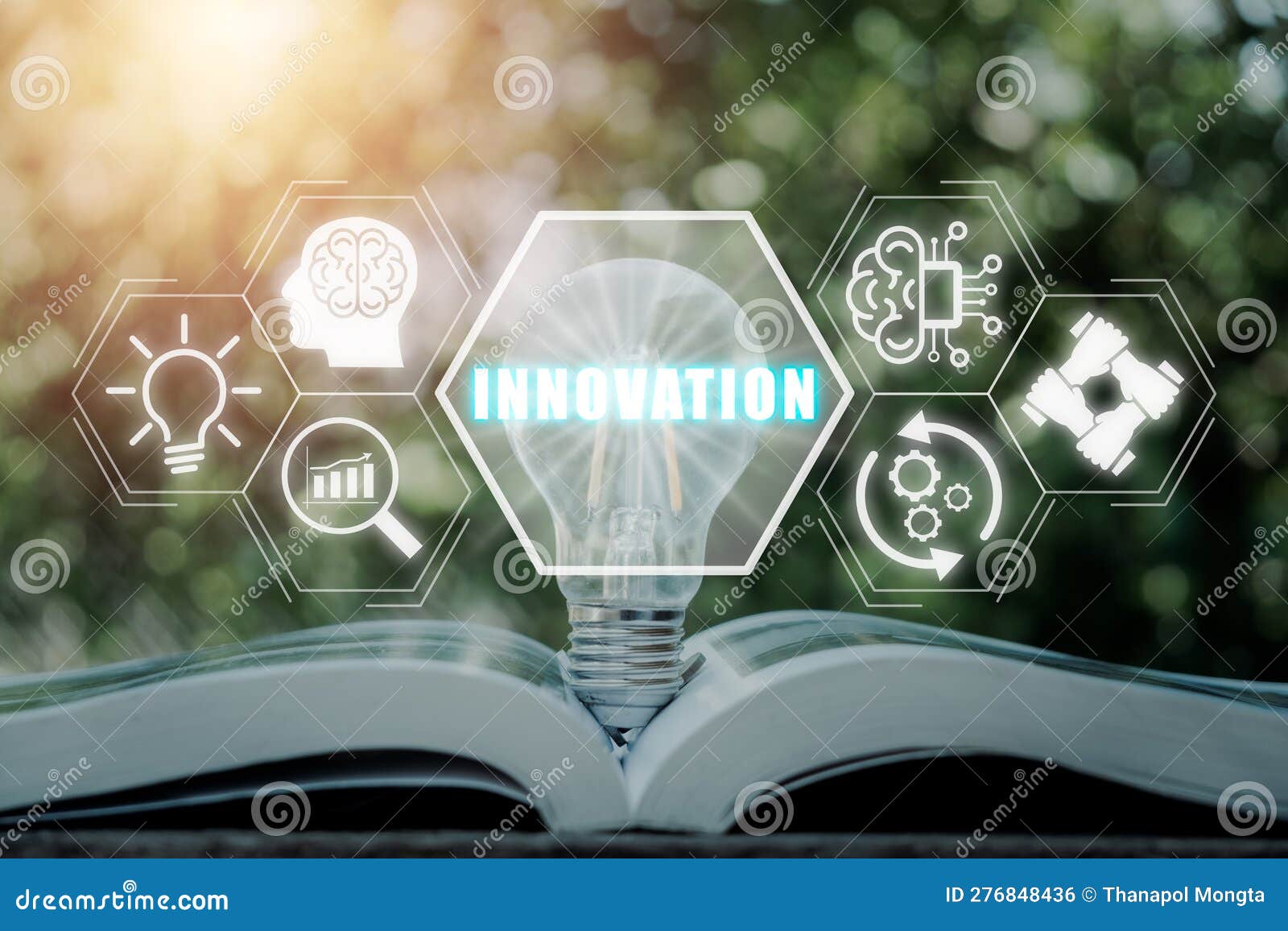 Light Bulb on Book with Innovation Icon on Virtual Screen Stock ...
