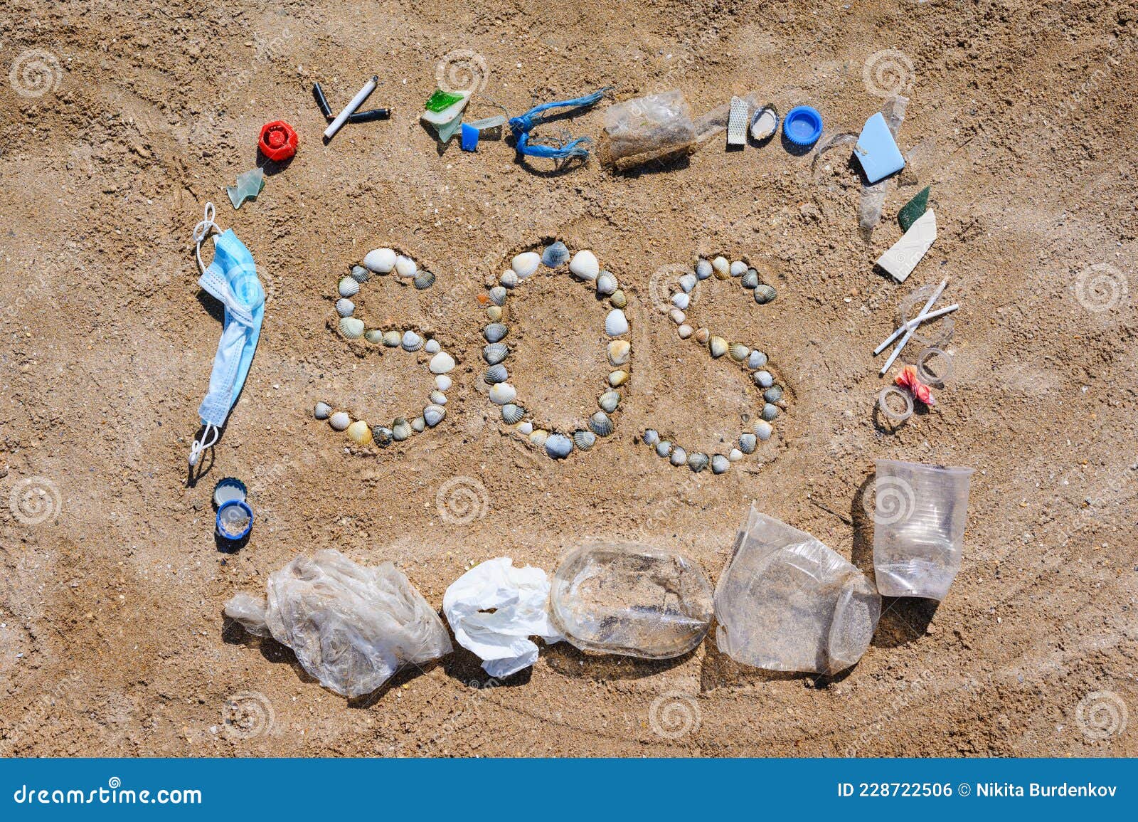 The Inscription SOS Made of Small Seashells on the Sand in a ...