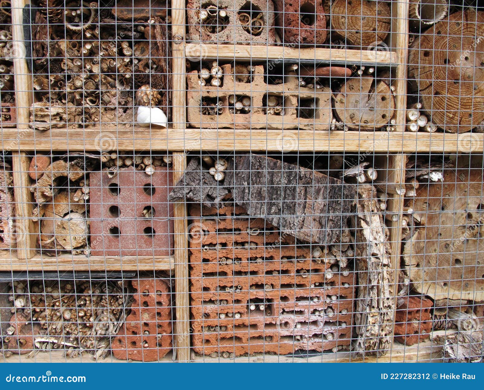 Insect Hotel with Brick, Bamboo Sticks and Bark Stock Photo - Image of ...