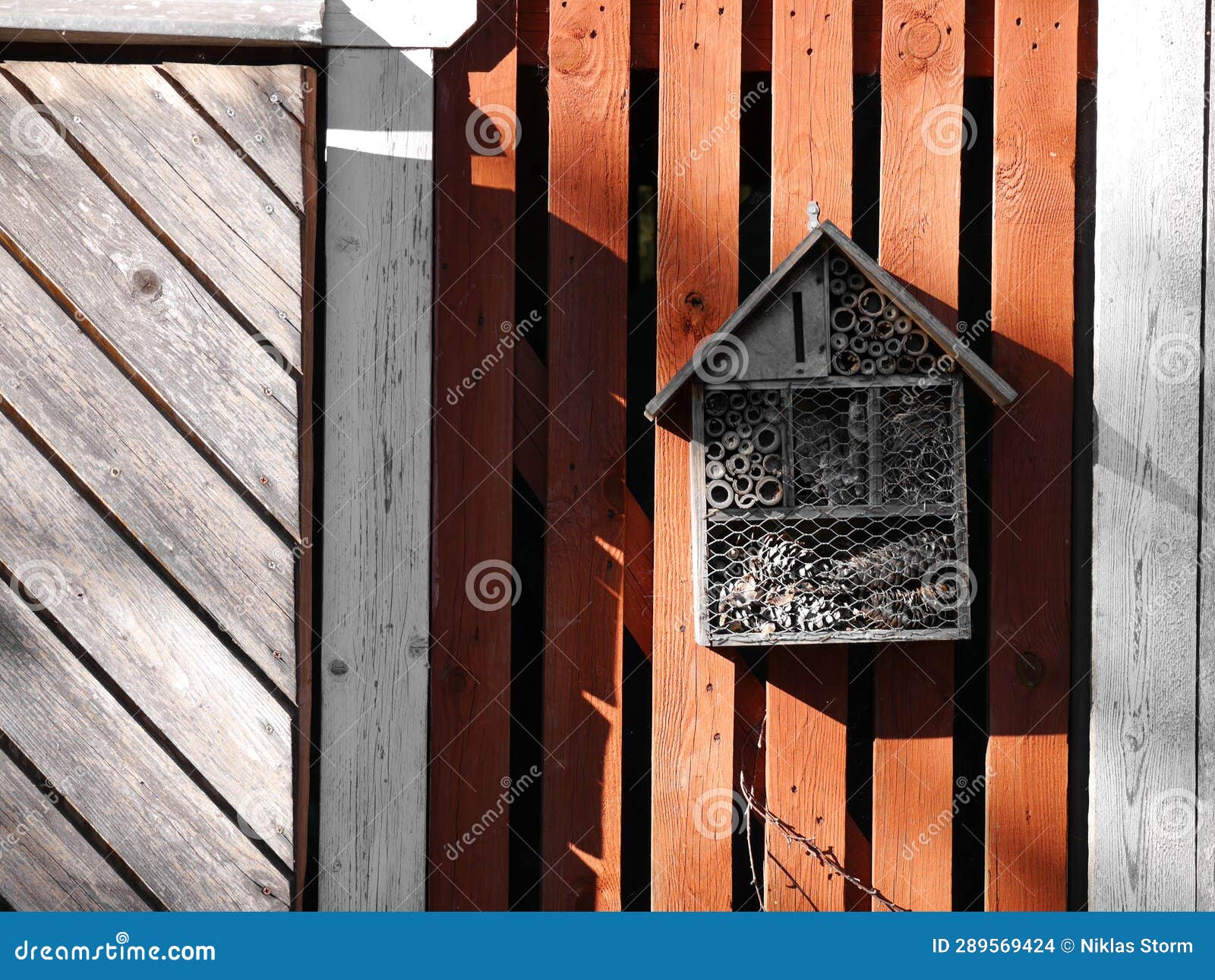 An Insect Hotel on the Wall of an Outhouse Stock Photo - Image of ...