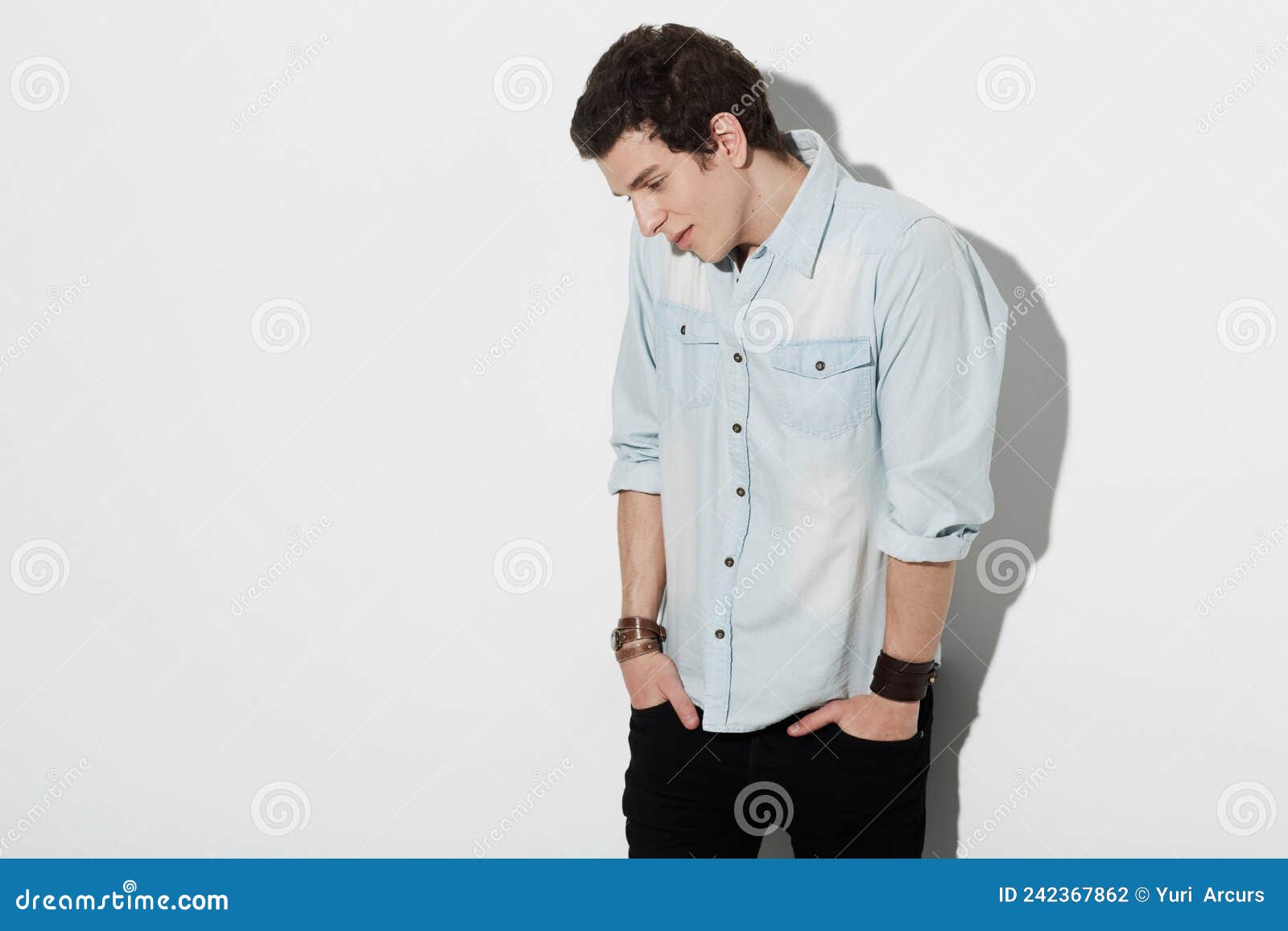 Insecurity. an Attractive Male Standing Awkwardly with His Hands in His ...