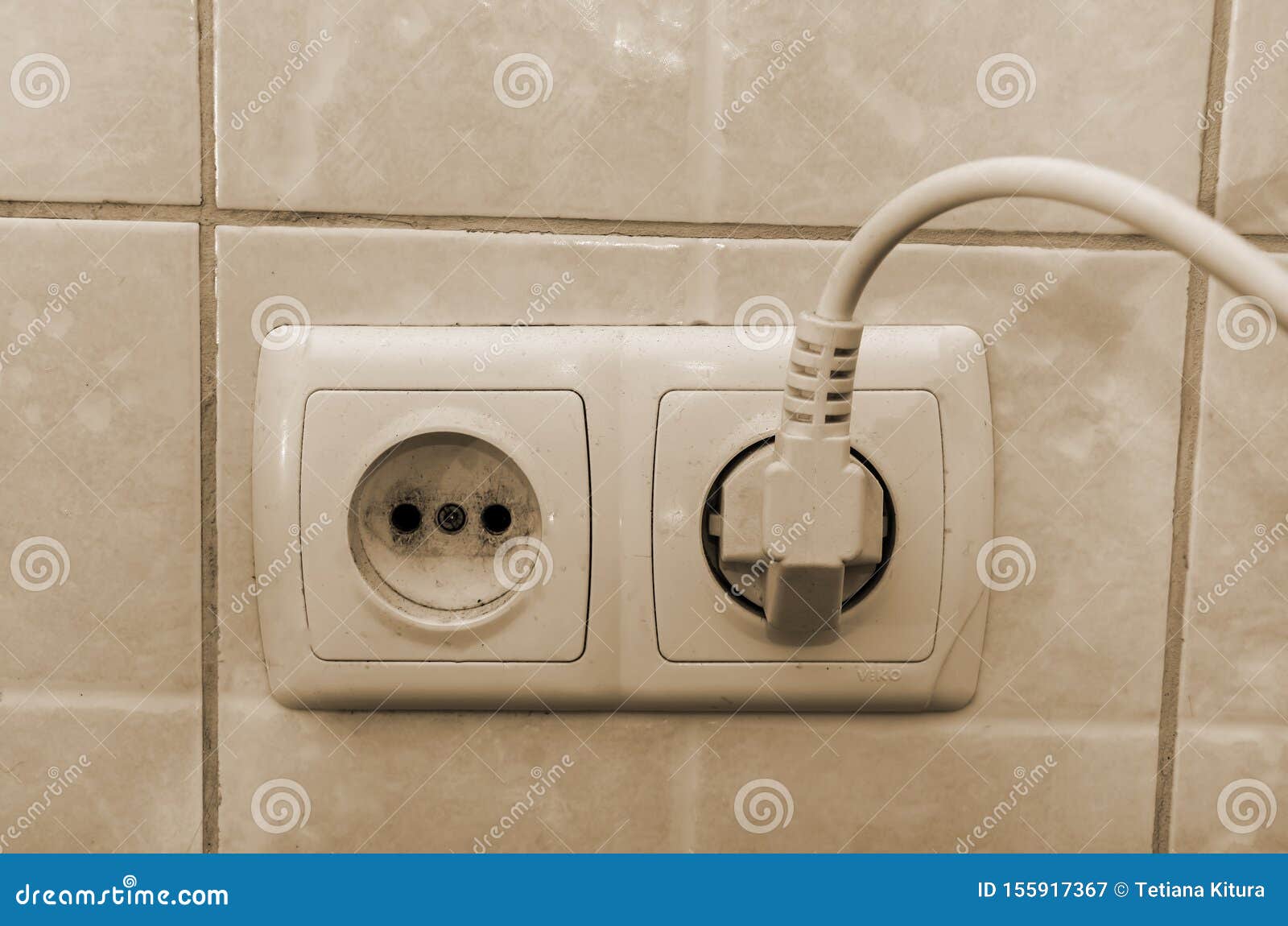 Insert the Plug into a Power Outlet. Socket in the Wall. Close-up ...