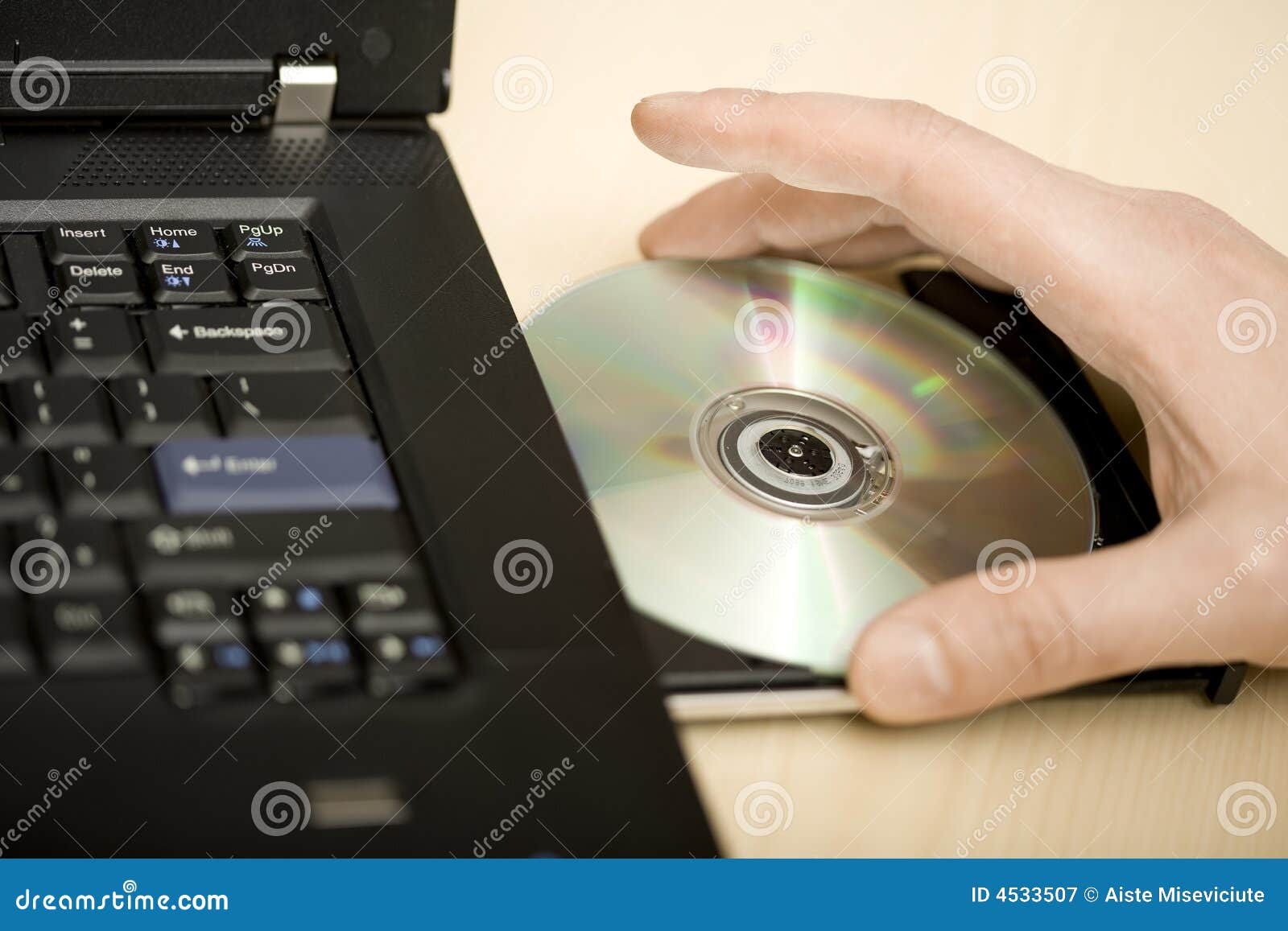 Inserting a cd stock image. Image of office, drive, movie - 4533507