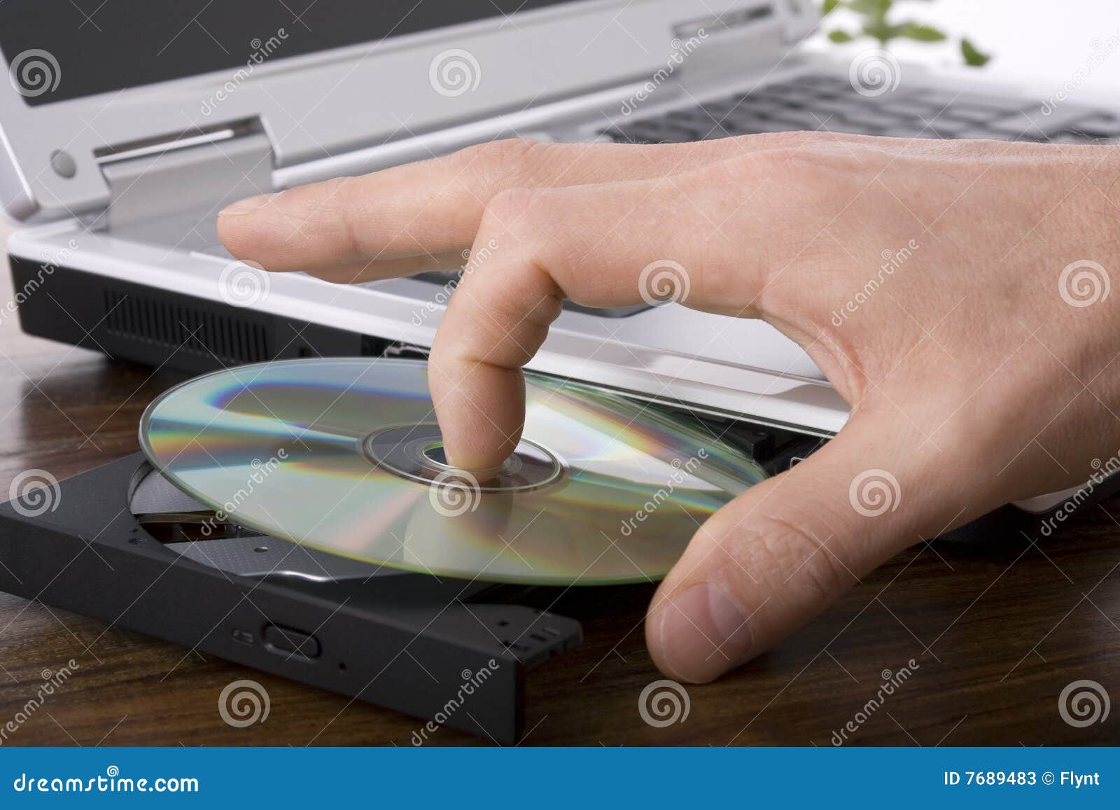 Inserting a DVD stock image. Image of music, disk, finger - 7689483