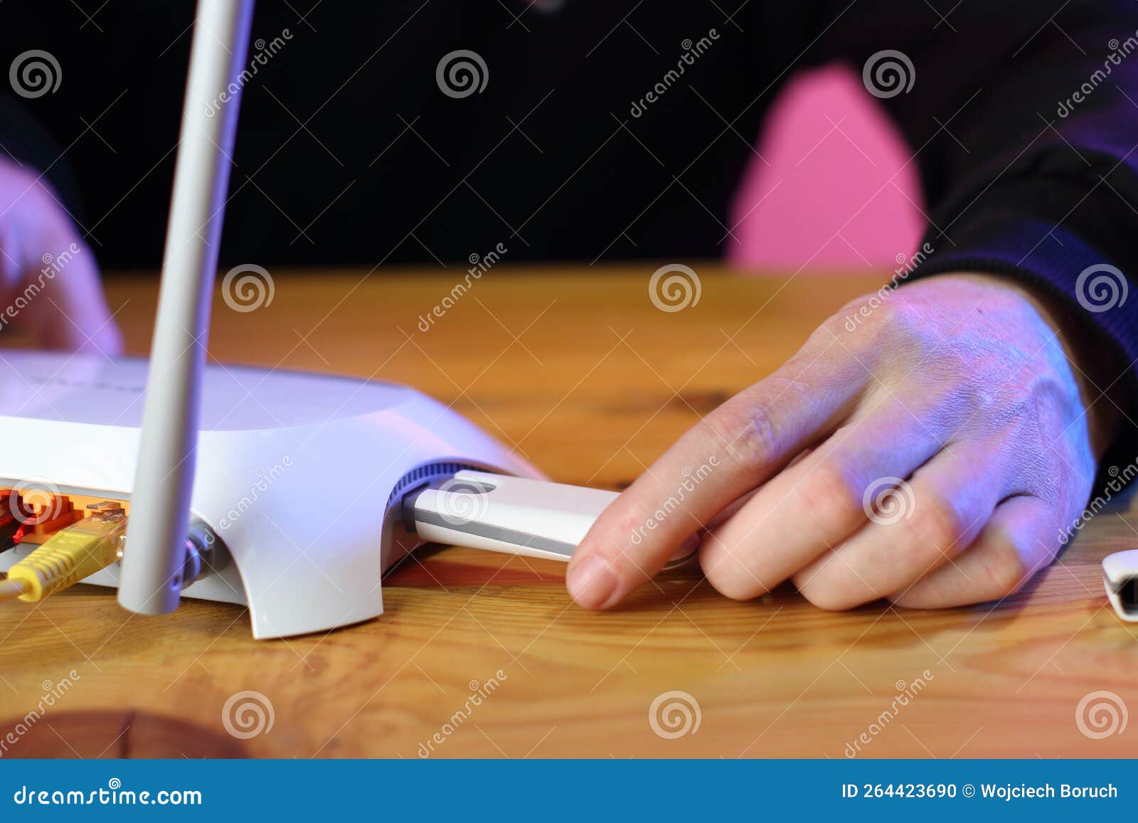 Inserting the Gsm Modem into the Router on the Table by the Person ...