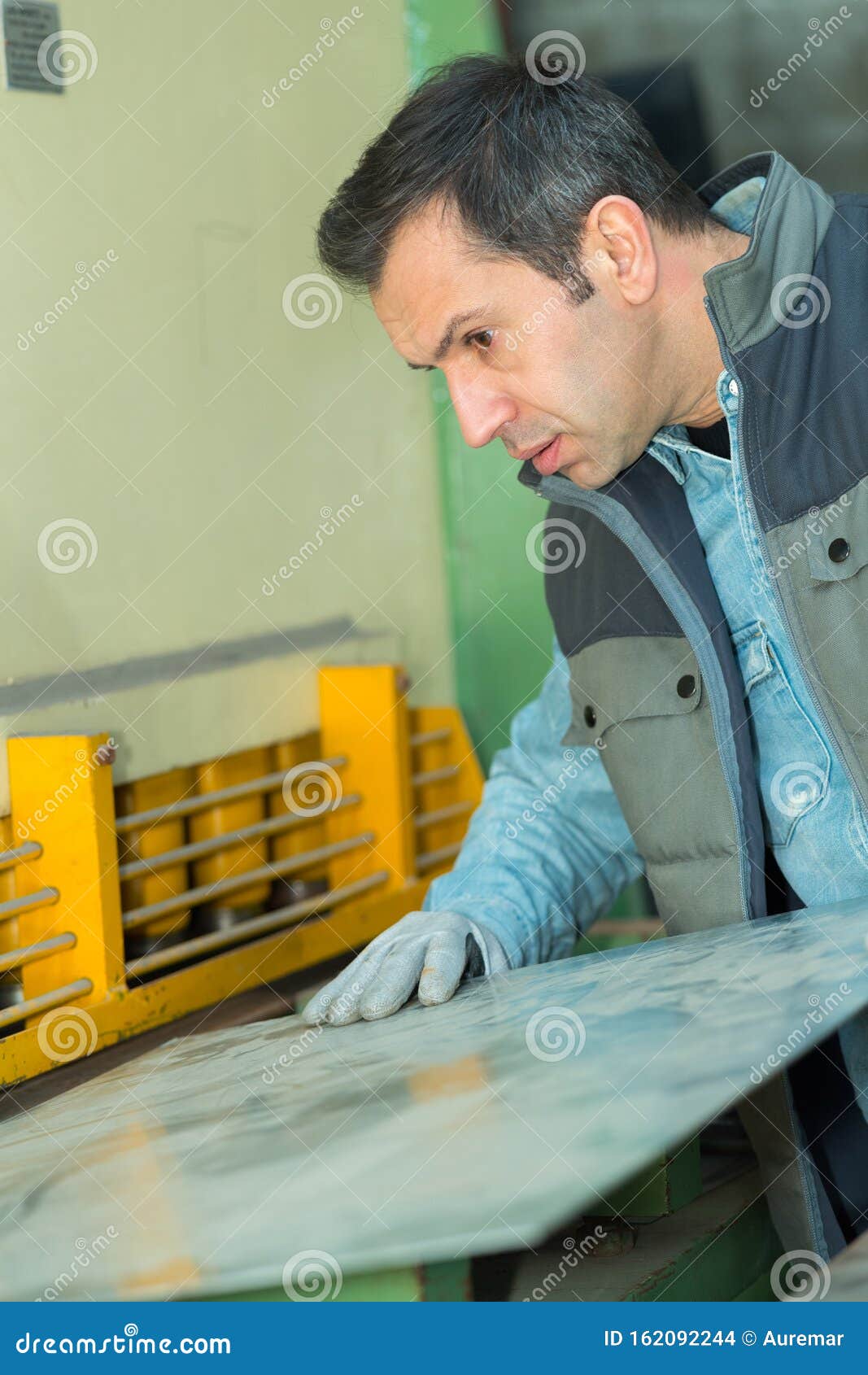 Inserting Metal Plate into Machine Stock Photo - Image of heat, light ...