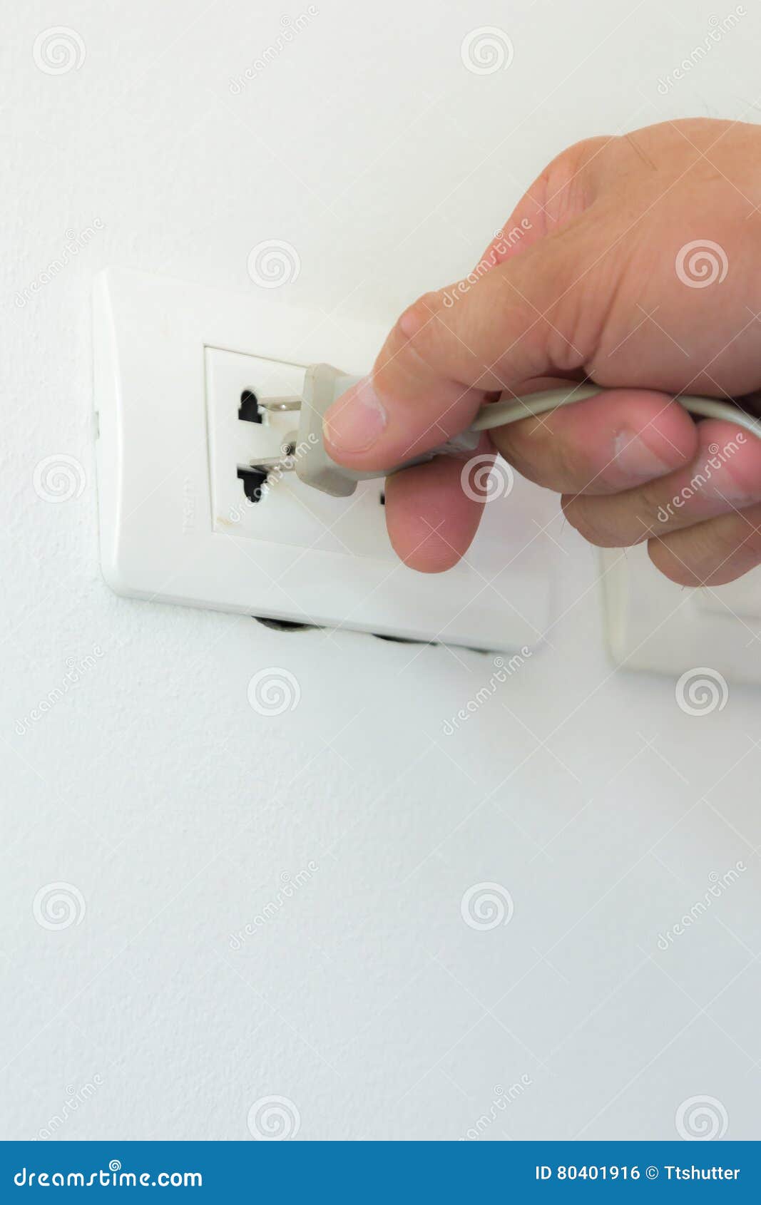 Inserting plug in outlet. stock photo. Image of input - 80401916