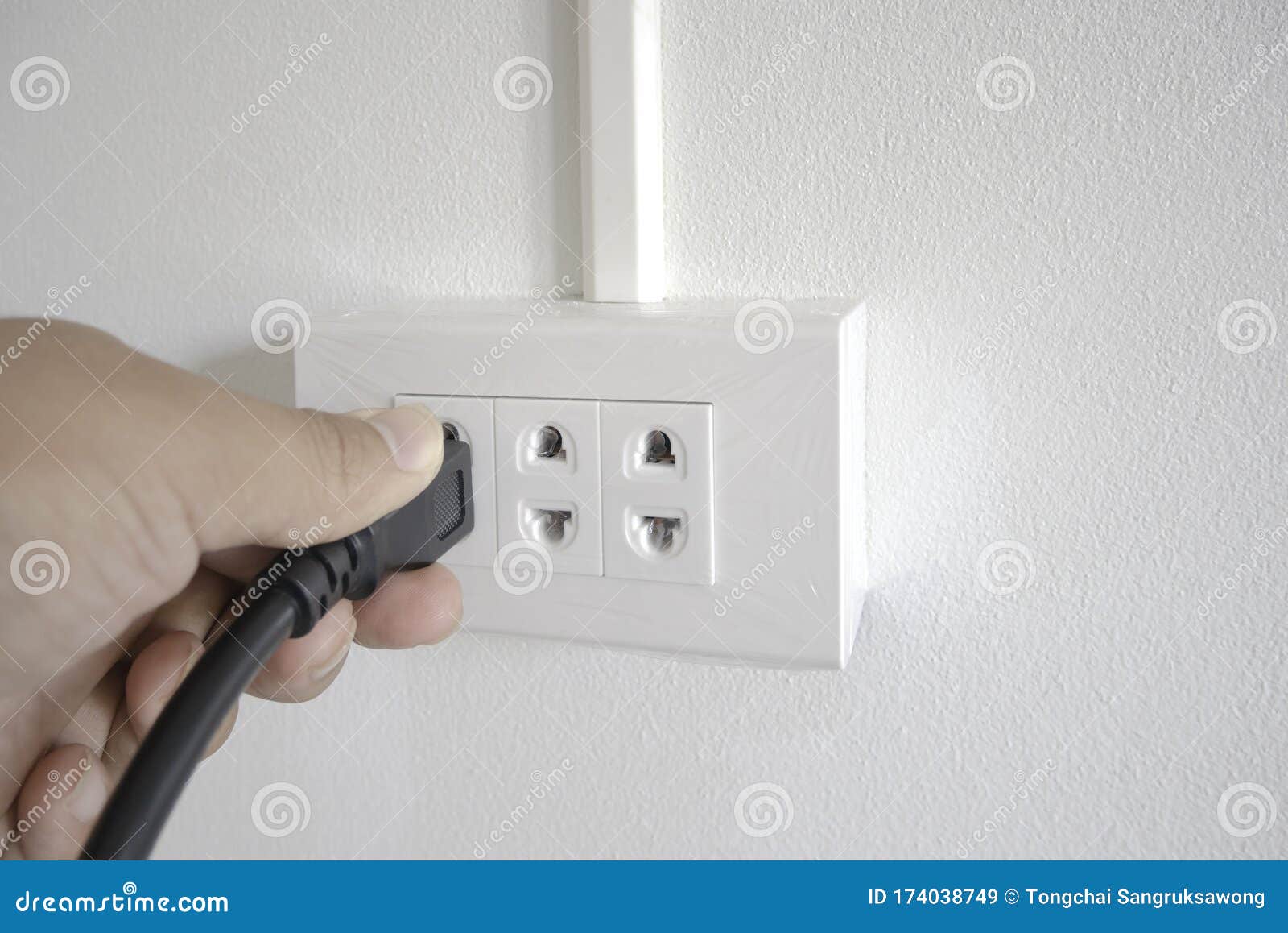 Inserting the Plug into the Socket. the Man Holds a Black Plug in His ...