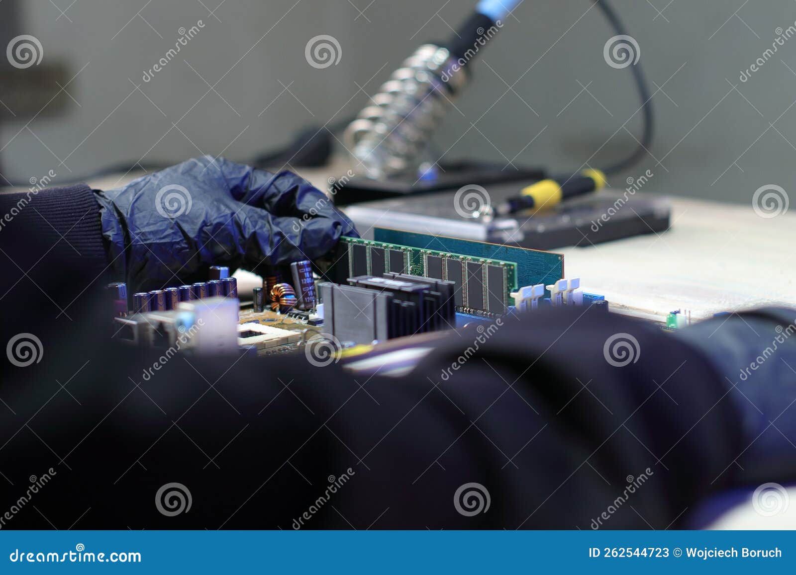 Inserting Ram Into Motherboard From Computer On Table Royalty-Free ...