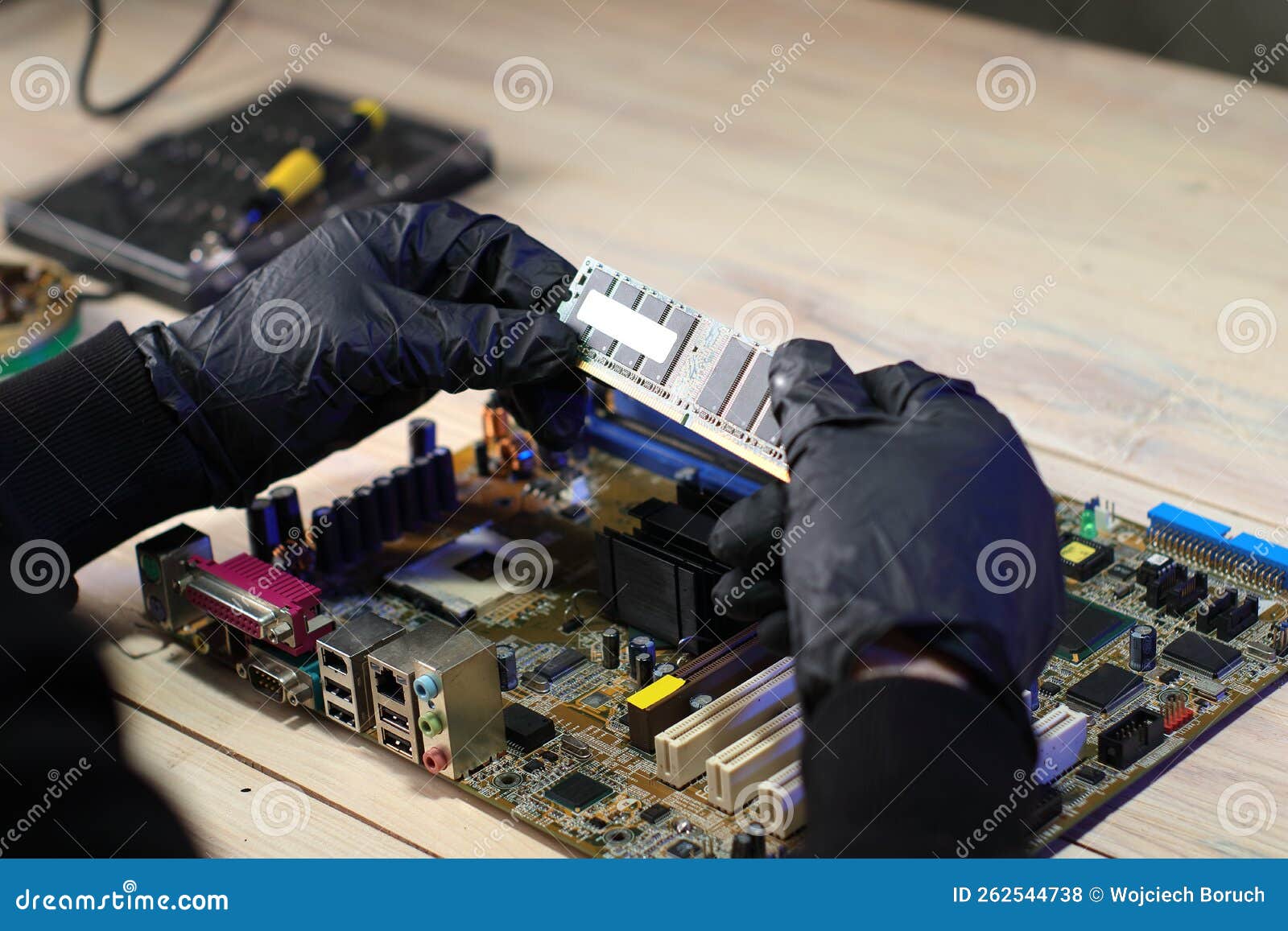 Inserting Ram Into Motherboard From Computer On Table Stock Photography ...