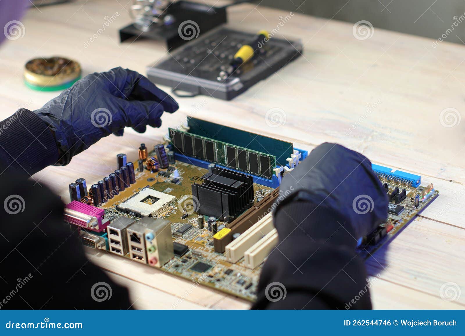 Inserting Ram Into Motherboard From Computer On Table Royalty-Free ... Inserting Ram Into Motherboard From Computer On Table Royalty-Free ...