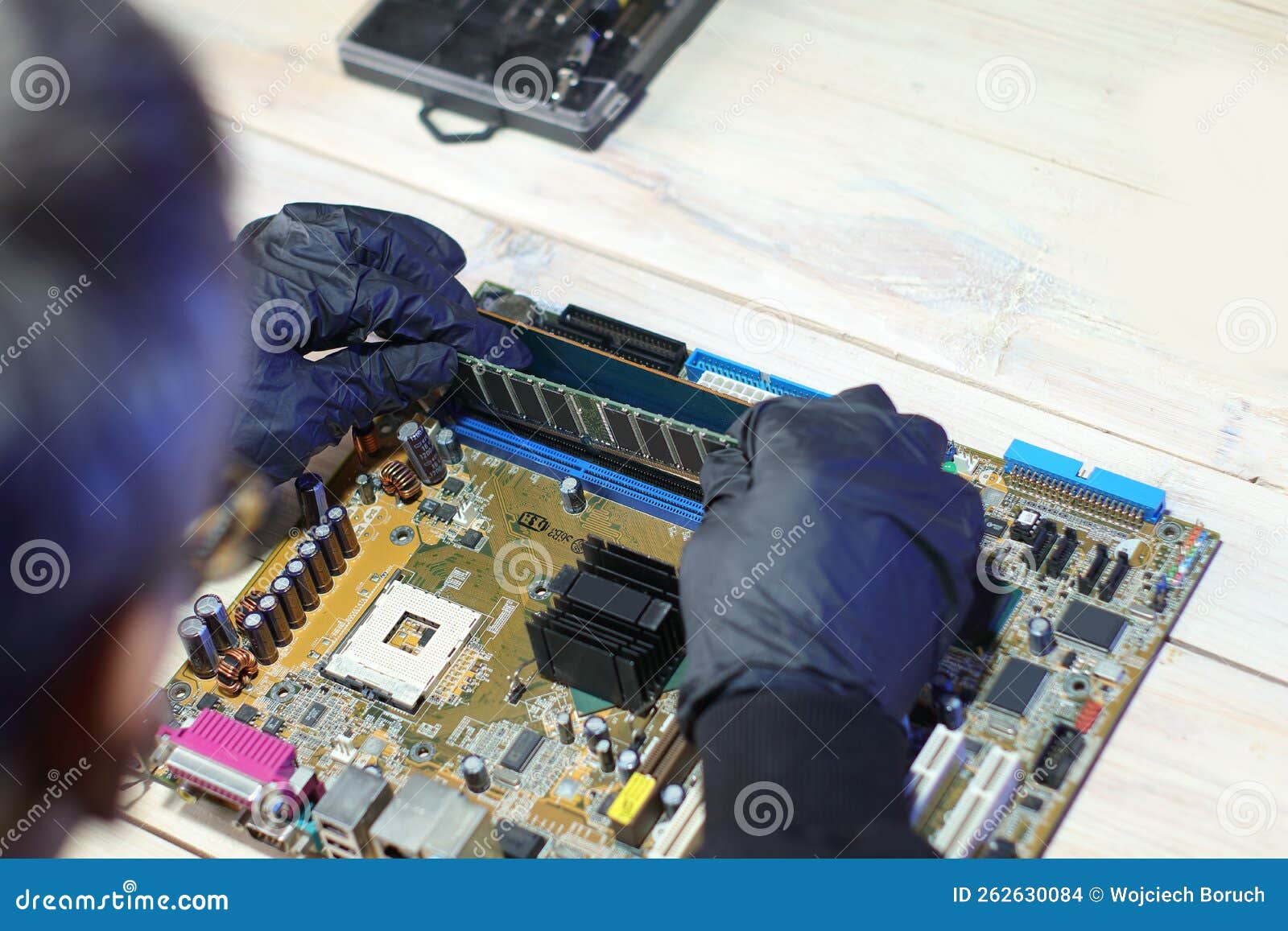 Inserting Ram Into Motherboard From Computer On Table Royalty-Free ...