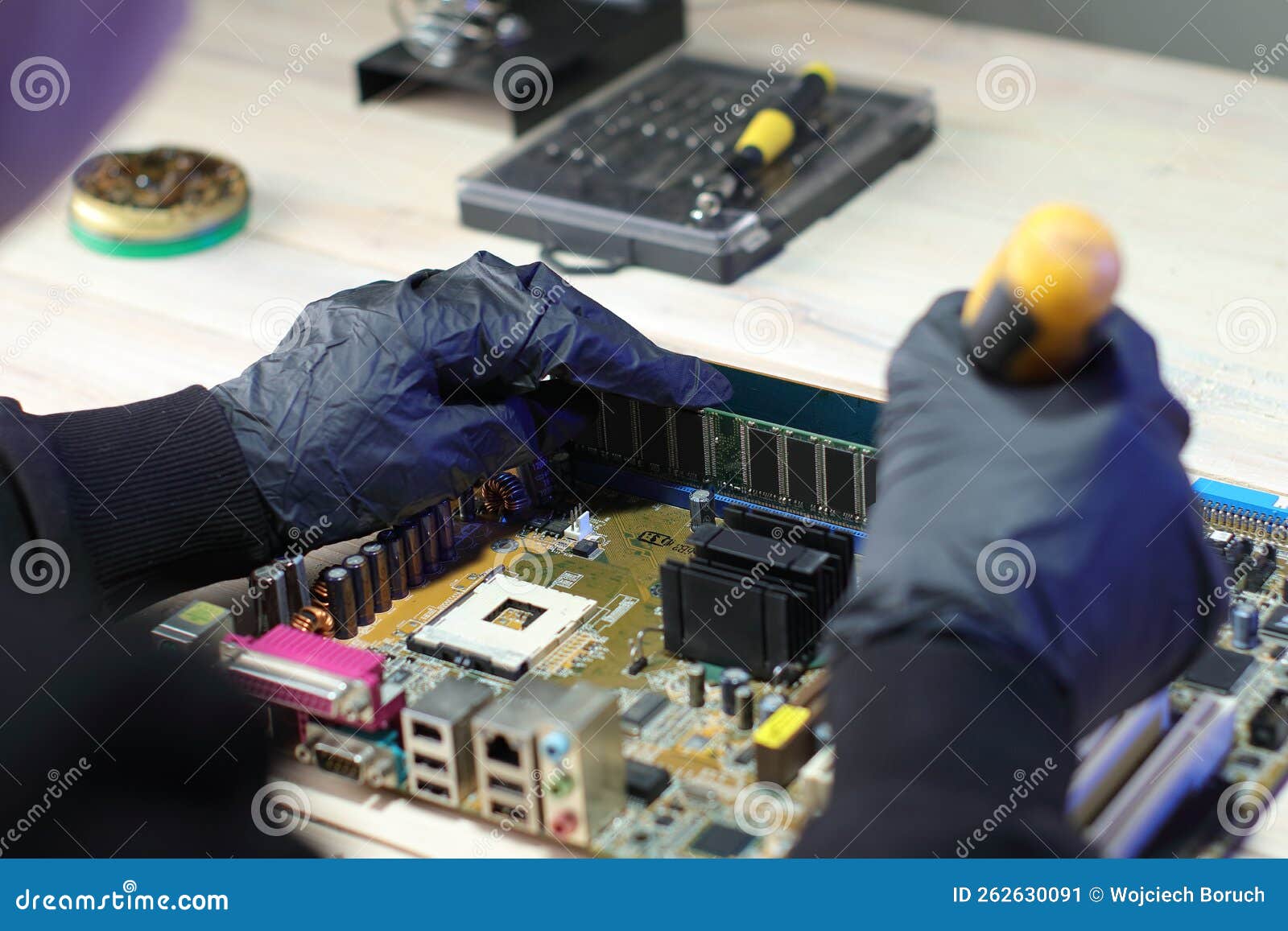 Inserting Ram Into Motherboard From Computer On Table Stock Photography ...