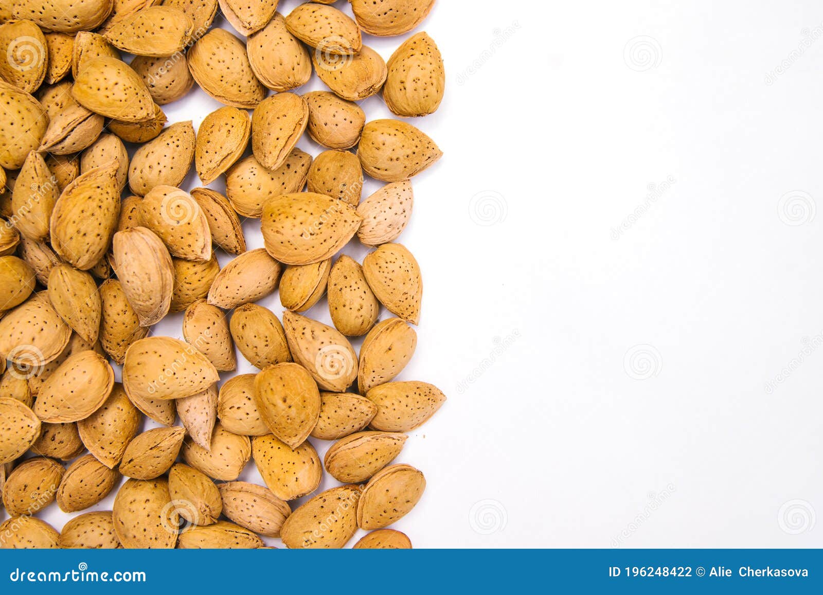 Inshell Almonds on a White Background. Almonds are Arranged in a Pile ...