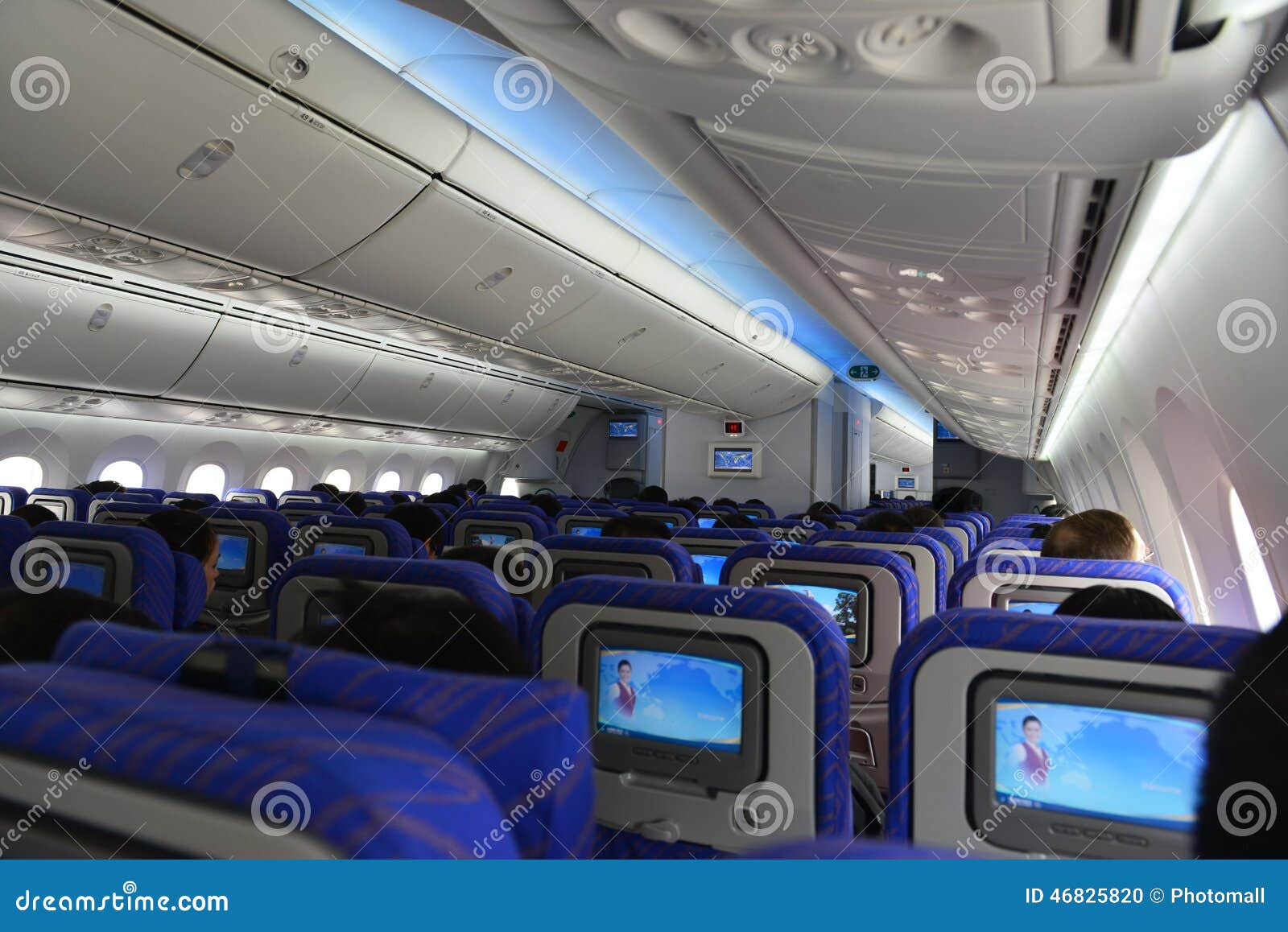 Inside Airplane Cabin with Seats, Passengers and Baggage Editorial ...