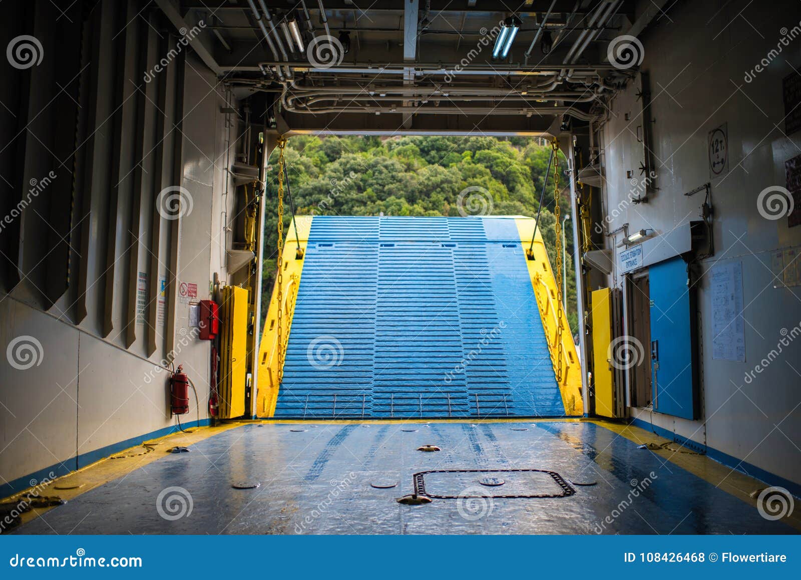 Inside Auto Deck on the Greek Ferry. Opening Bow Ramp and the Cloudy ...