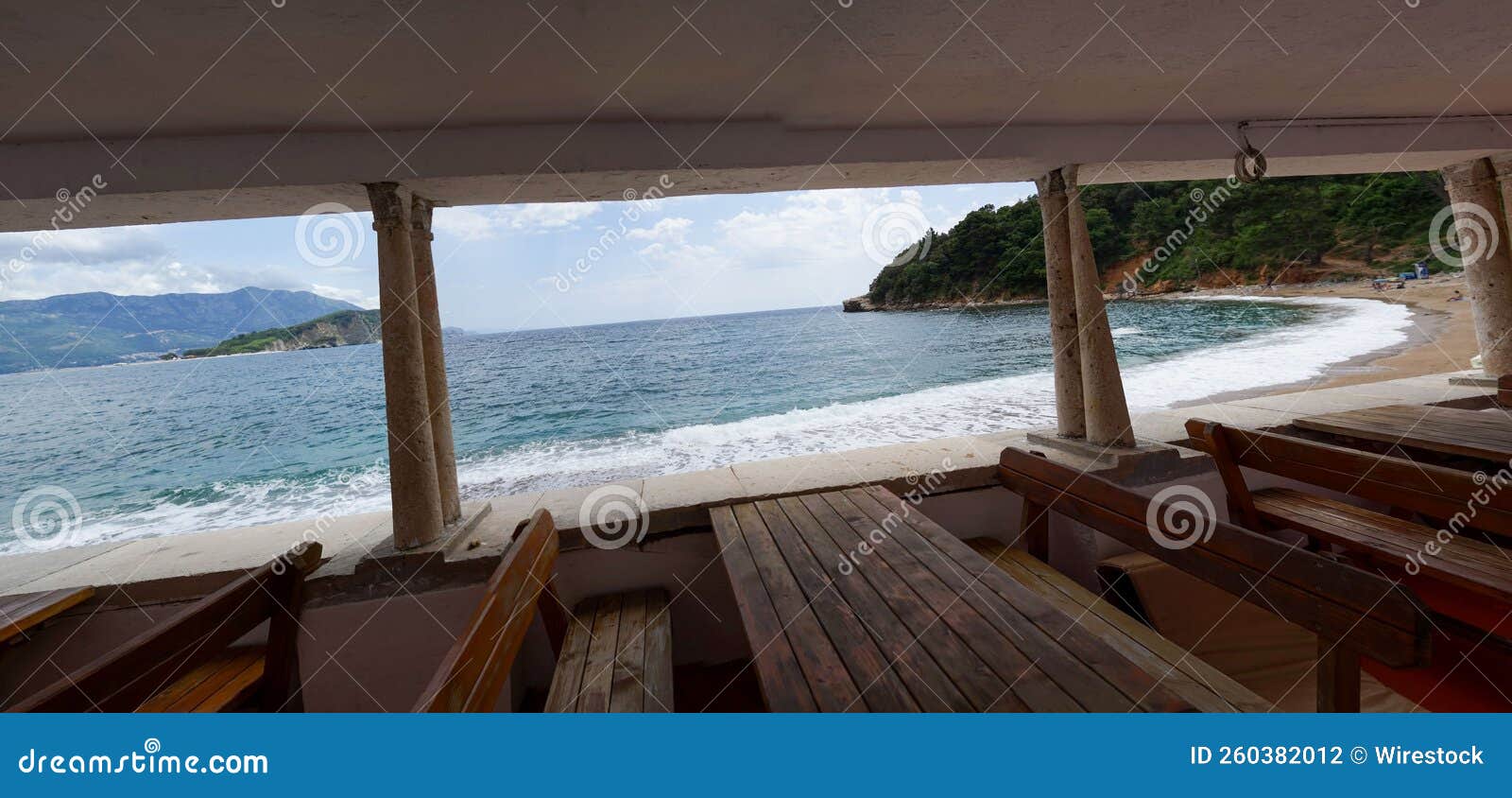 Inside of a Beach Cafe with Wooden Tables and Chairs, with a Blue ...