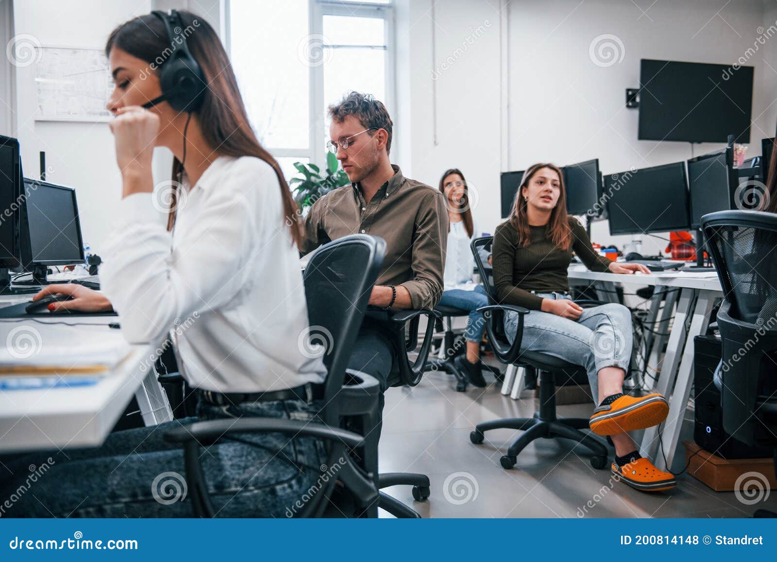 Inside of Call Center. Young Business People Working Together in the ...