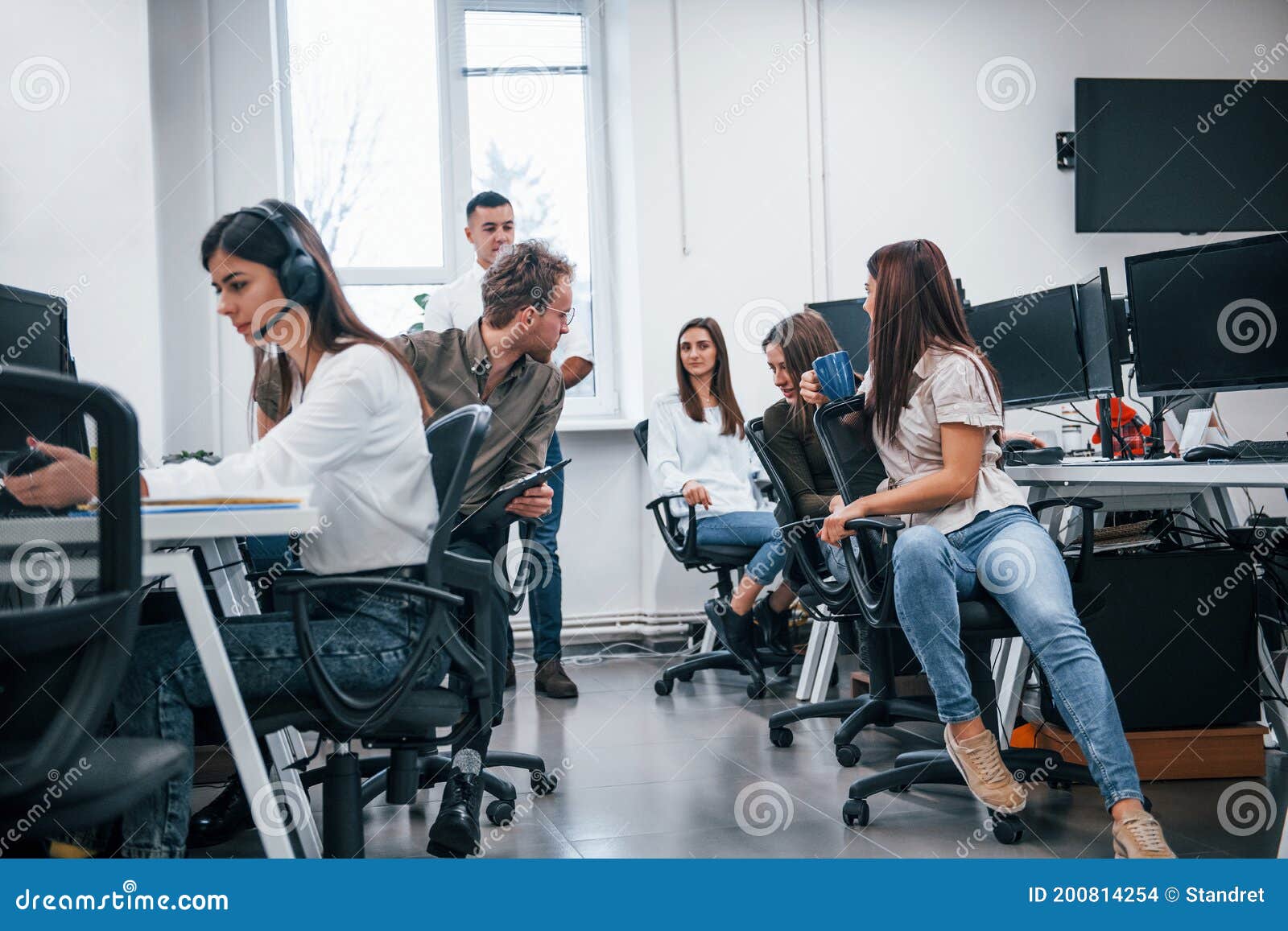 Inside of Call Center. Young Business People Working Together in the ...