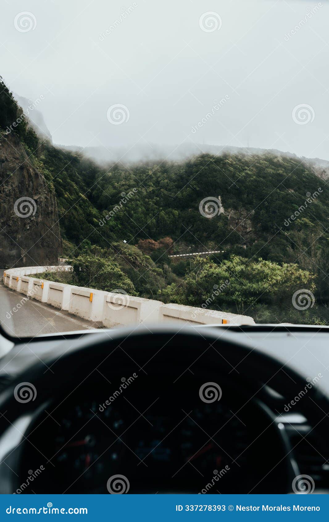 Inside Car View Driving Down a Winding Road with a Mountain in the ...