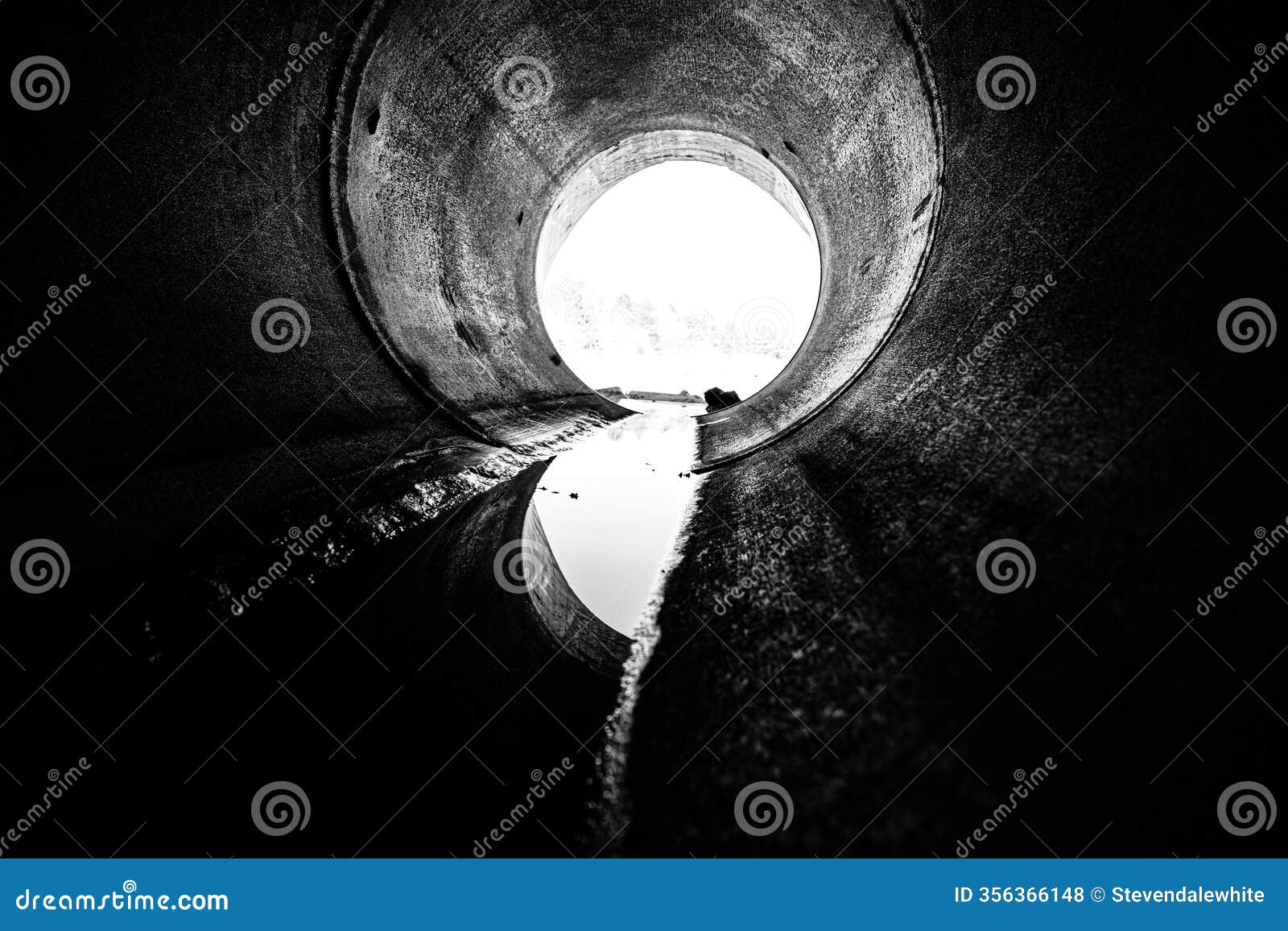 Inside a Circular Concrete Drainage Culvert with a Trickle of Water ...