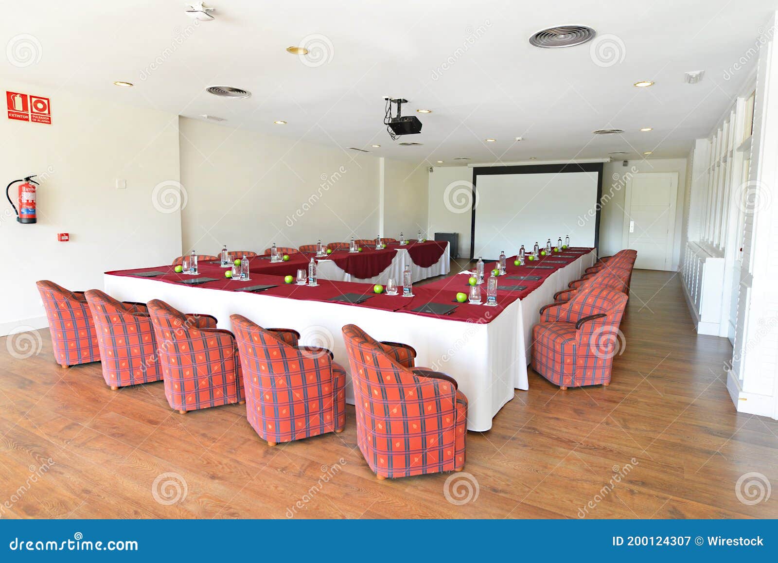 Inside of a Conference Hall with Set-up Chairs and Tables and a Screen ...