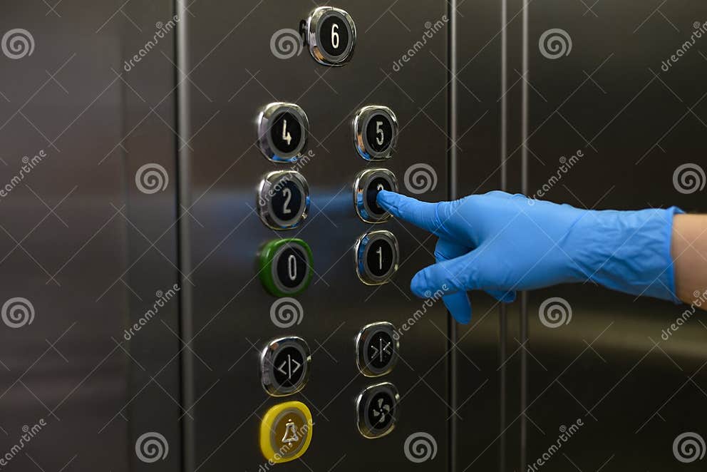 Inside the Elevator. a Female Hand is about To Press the Elevator ...