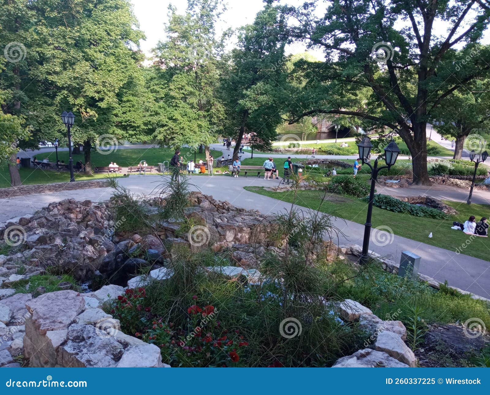 Inside of a Park in Riga Lativa, with People Walking or Sitting on the ...