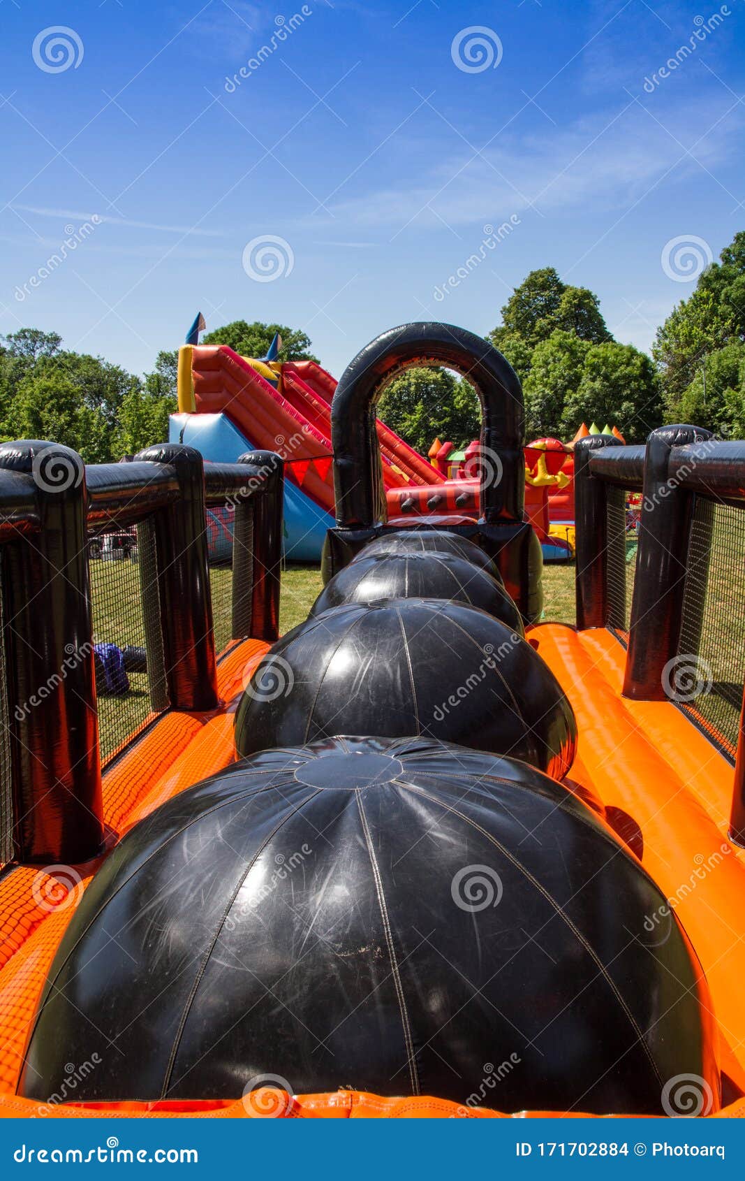 Inside a Rubber Inflatable Obstacle Course Stock Photo - Image of trees ...