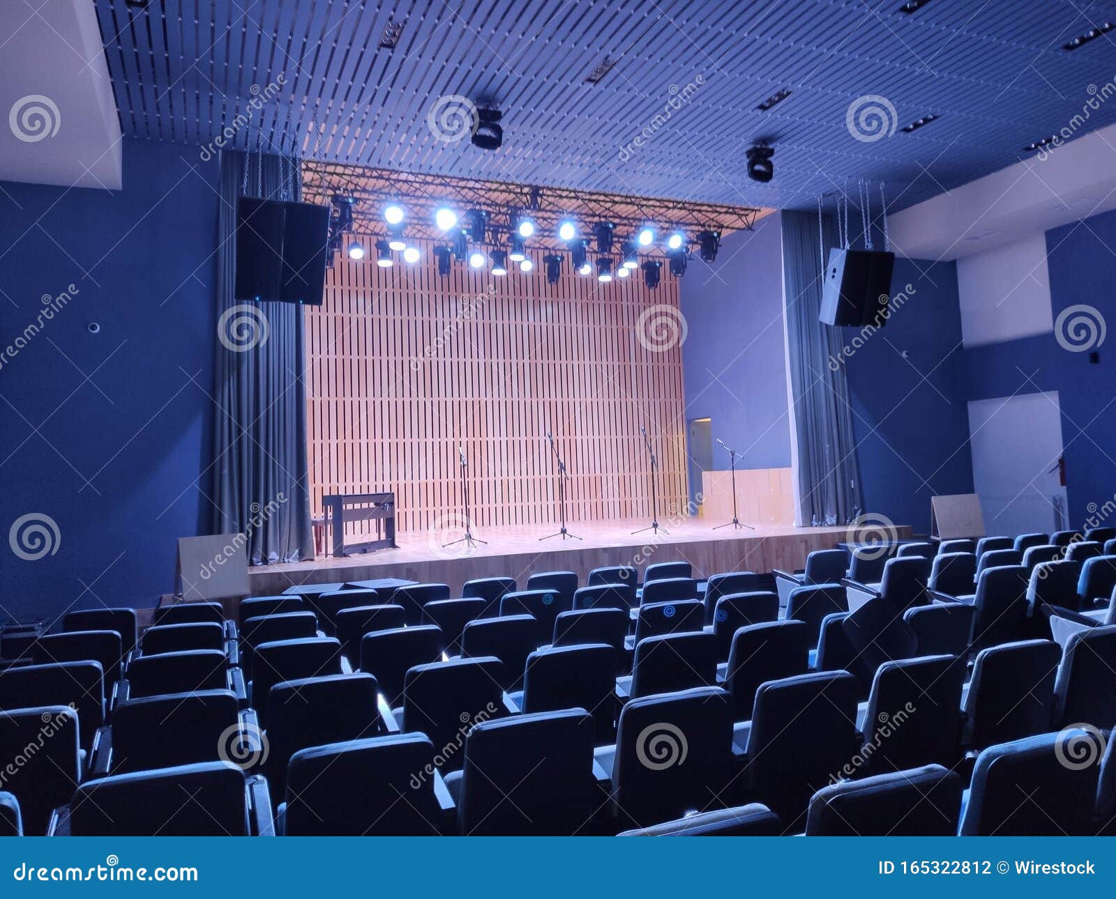 Inside Shot of a Small Empty Auditorium with Four Microphones on the ...