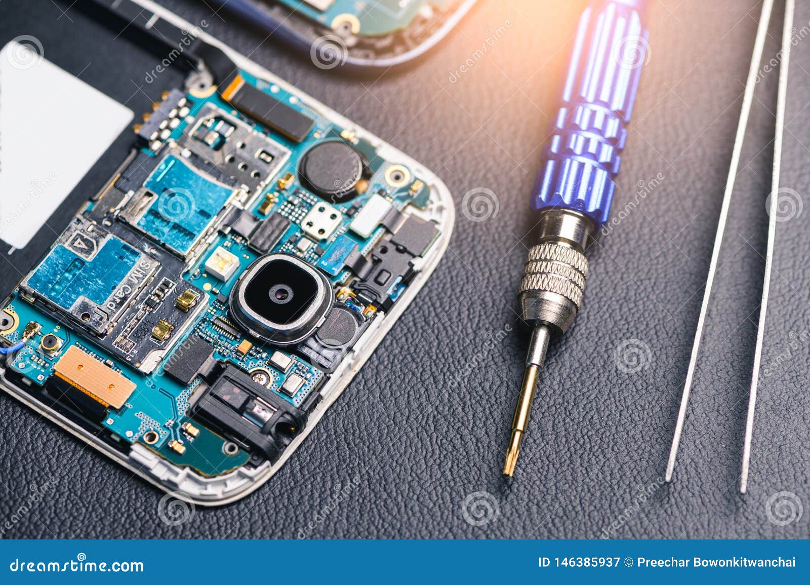 The Inside of the Smartphone`s Motherboard and Tools Lay on the Back ...
