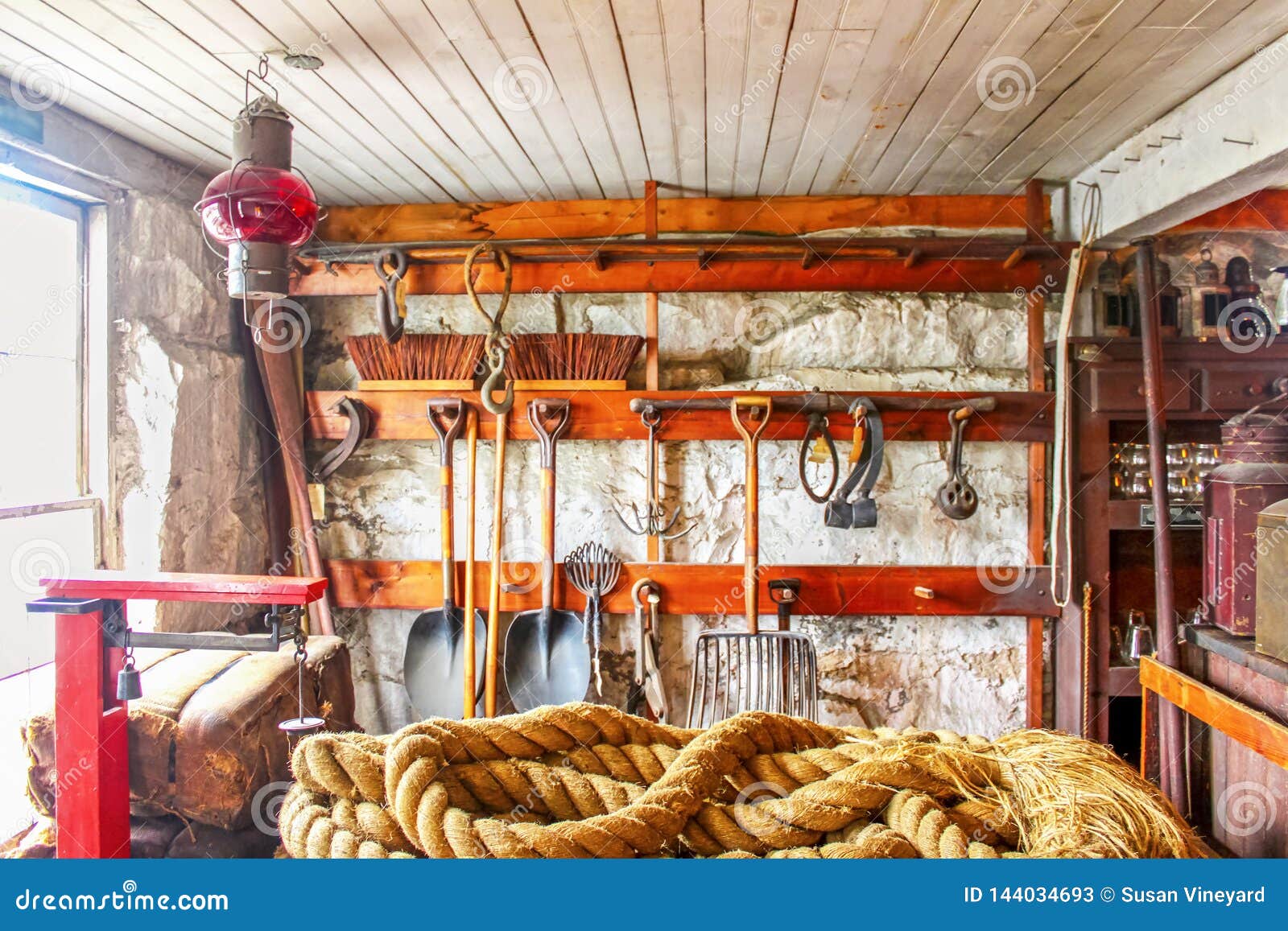 Inside of a Tool Shed with Coiled Rope in Foreground and a Variety of ...