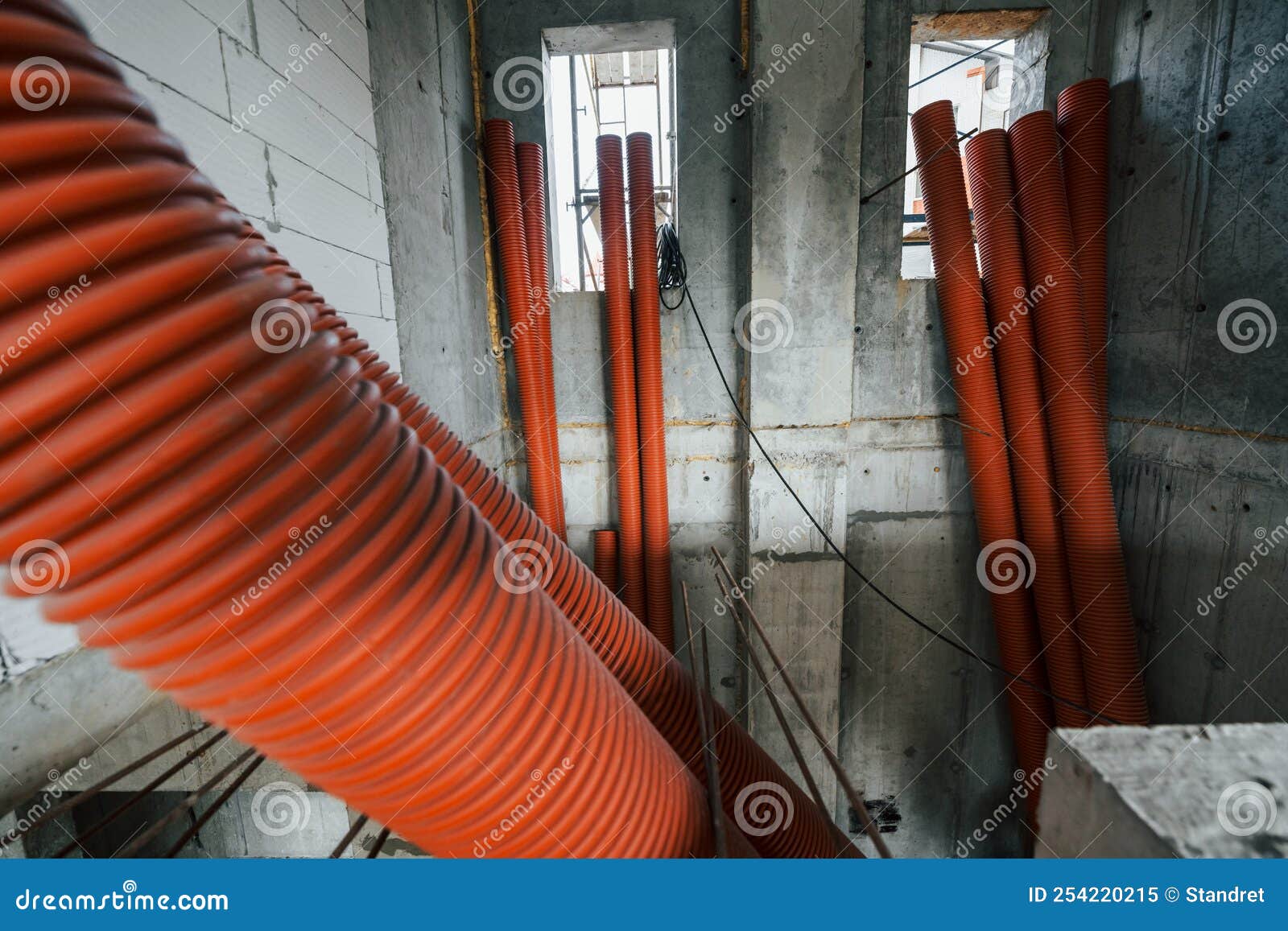 Inside of the Unfinished Building. Orange Colored Pipes Stock Image ...