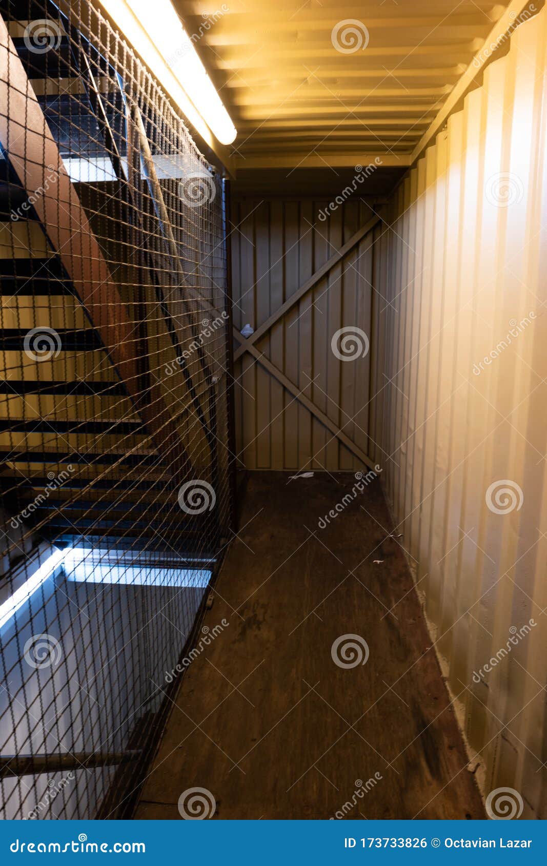 Inside View of Converted Shipping Container with Stairs and Artificial ...