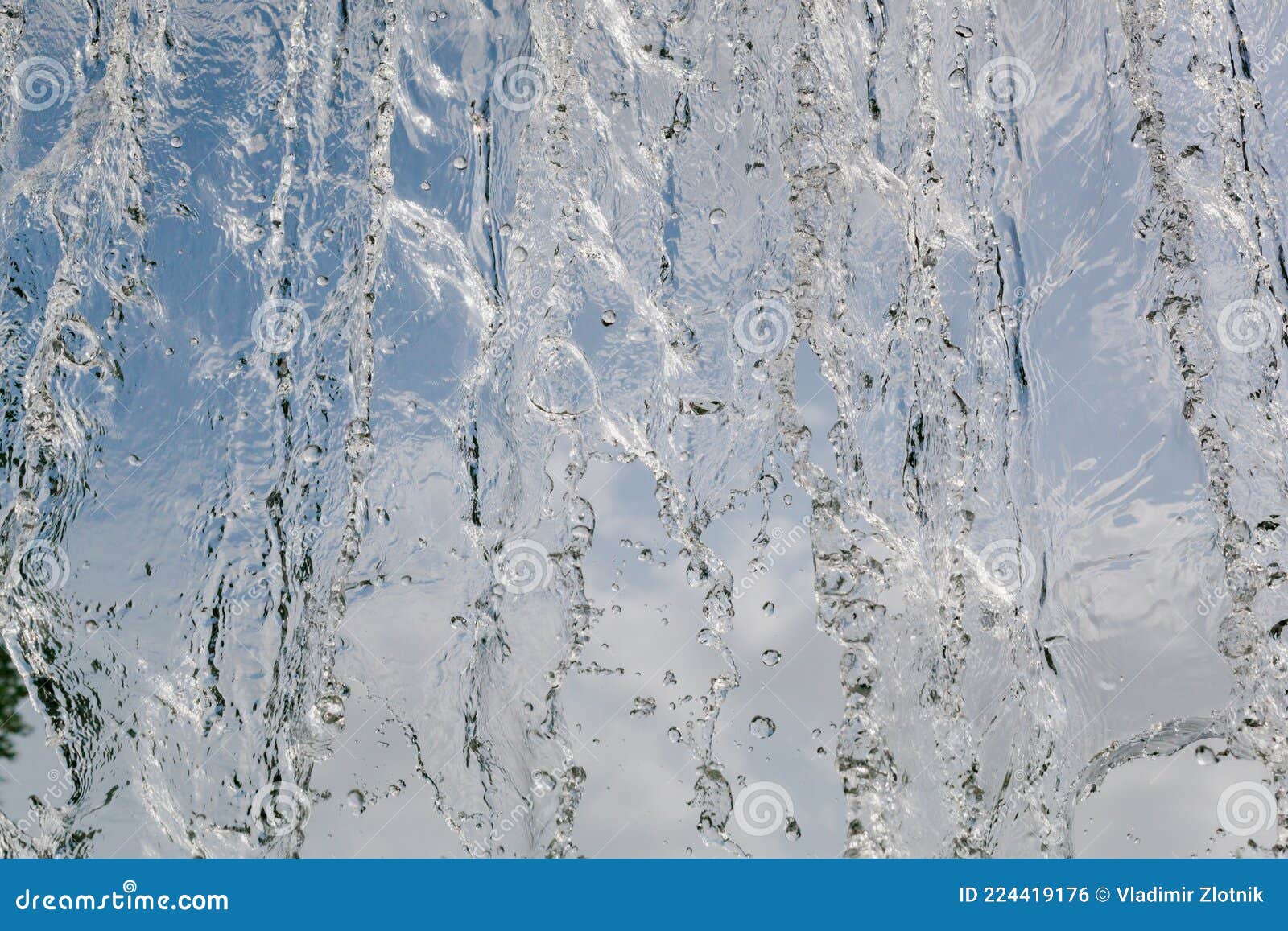 Inside View of the Falling Water of the Waterfall Against the Blue Sky ...