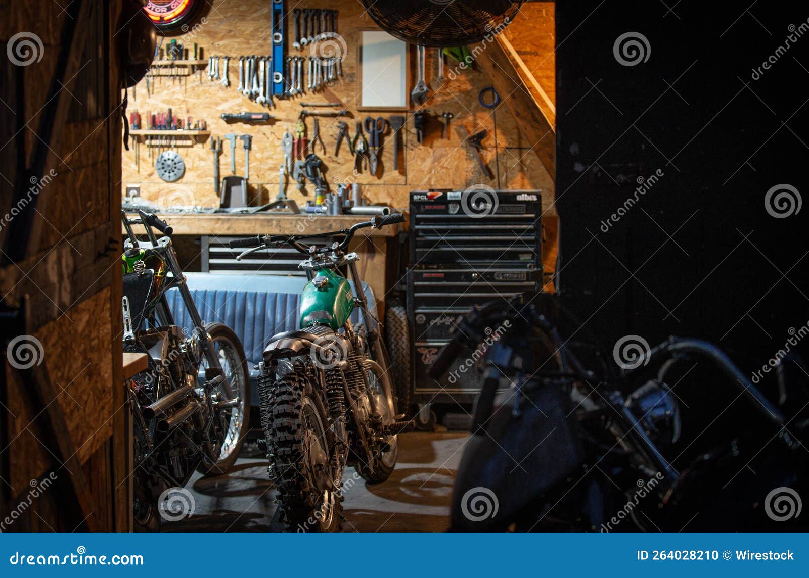 Inside View of a Garage with Motorcycles and Instruments on the Wall ...