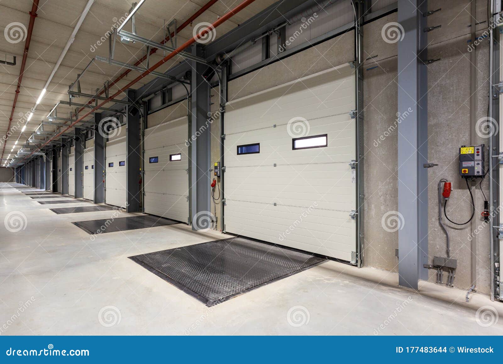 Inside of a Warehouse with a Row of Loading Bays Stock Photo - Image of ...