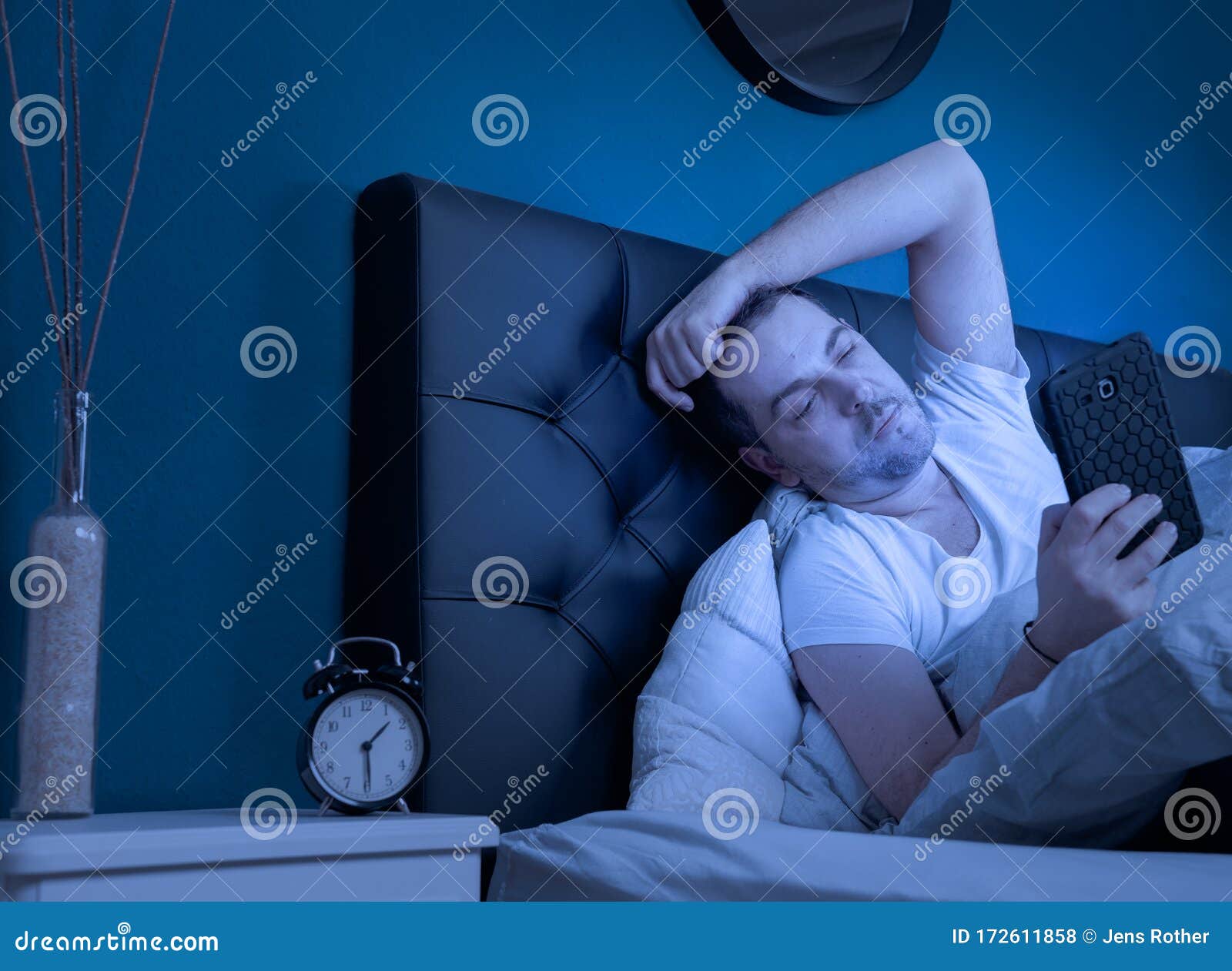Insomnia Due To Playing on the Cell Phone at Night Stock Photo - Image ...