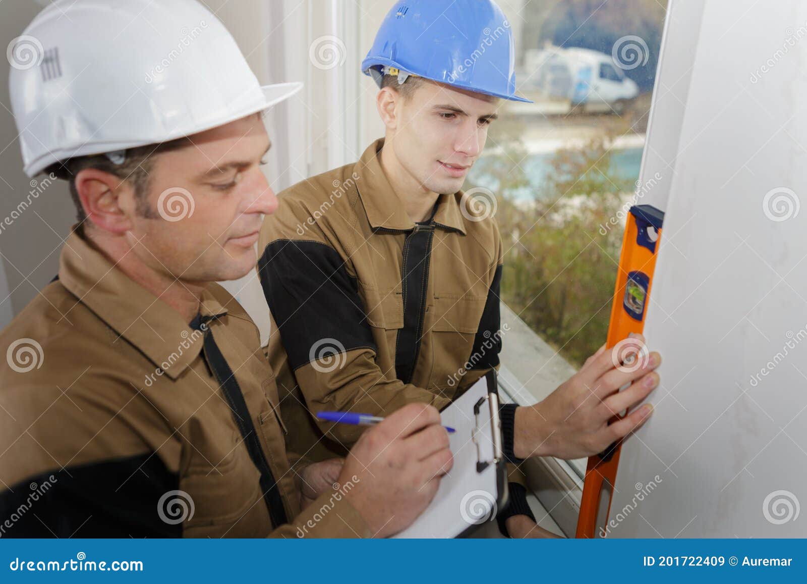 Alignment Of Windows And Mineral Wool Insulation On A Building Under ...